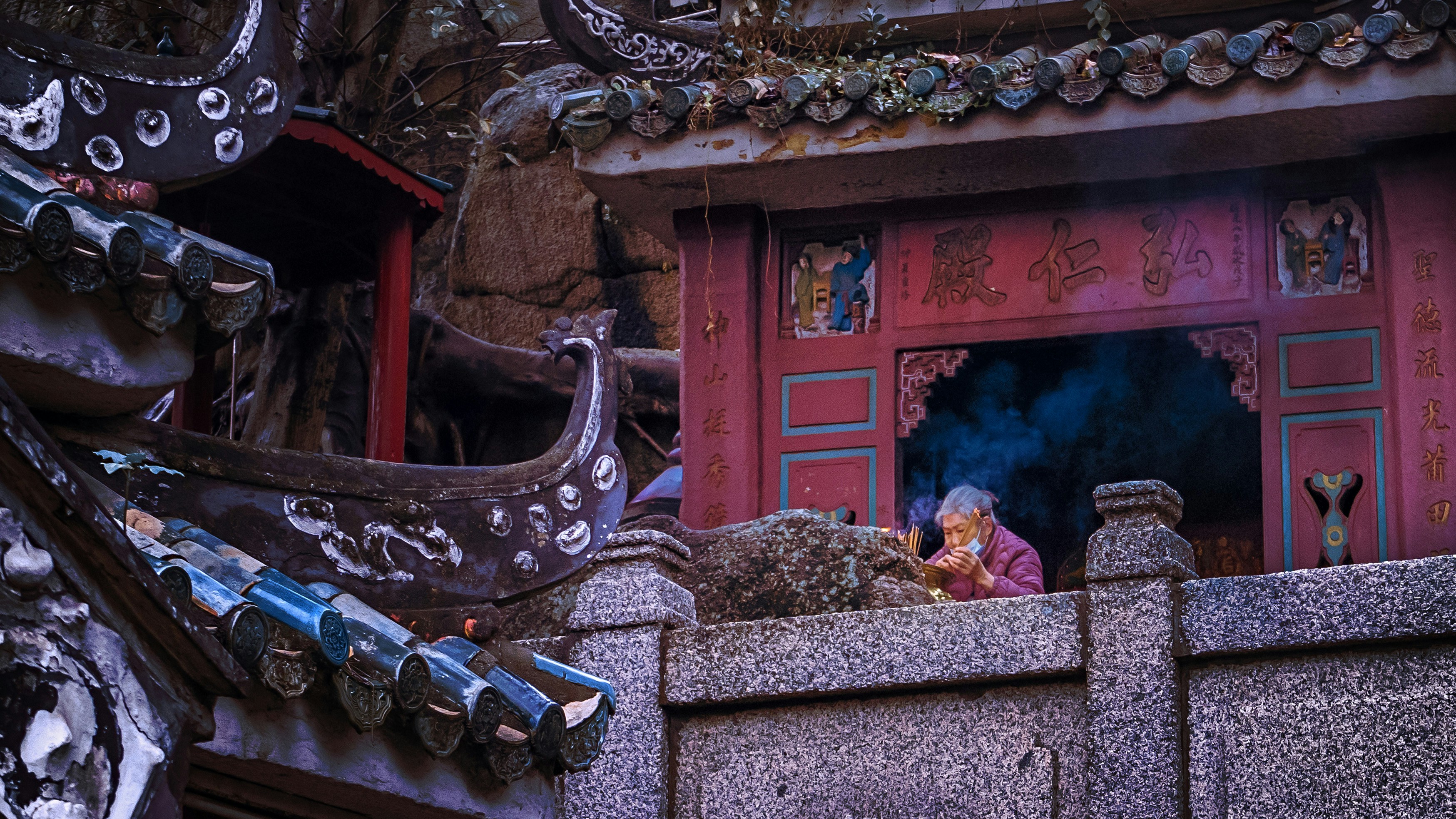 Evening Whisper at the Red Shrine: An Elder Resting Amid Ornate Carvings