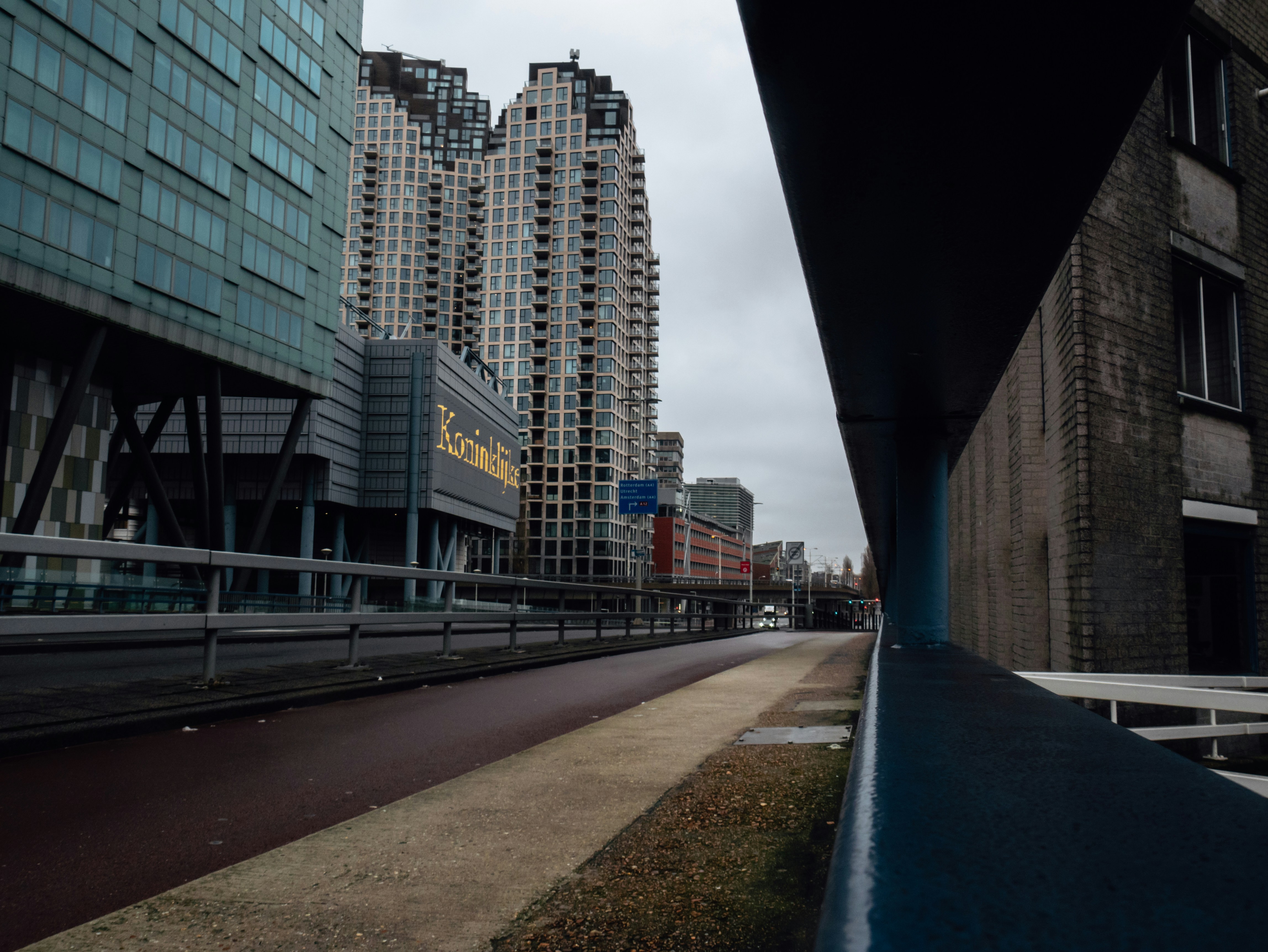 a city street with tall buildings in the background