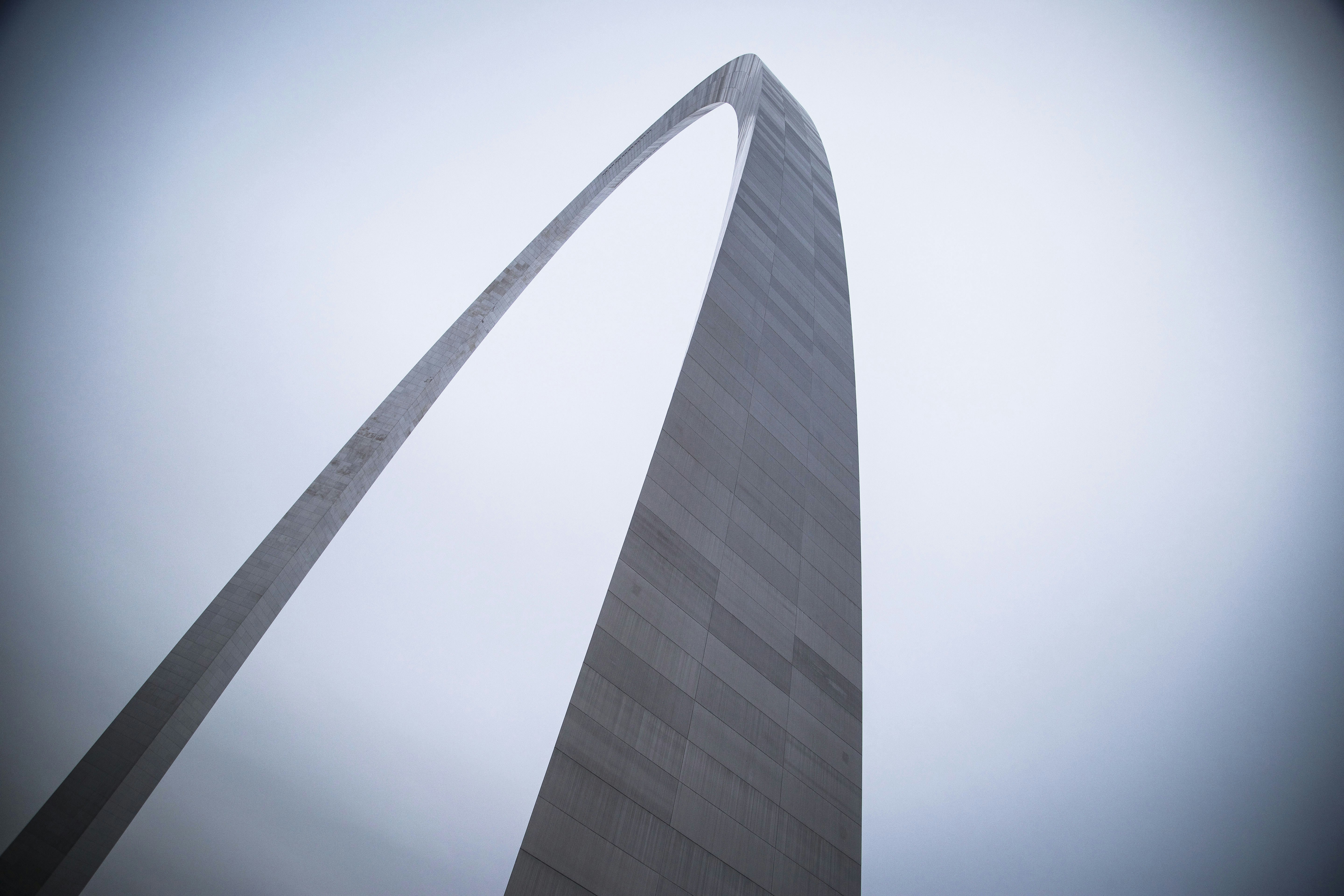 A very tall building with a very tall monument in the background photo ...