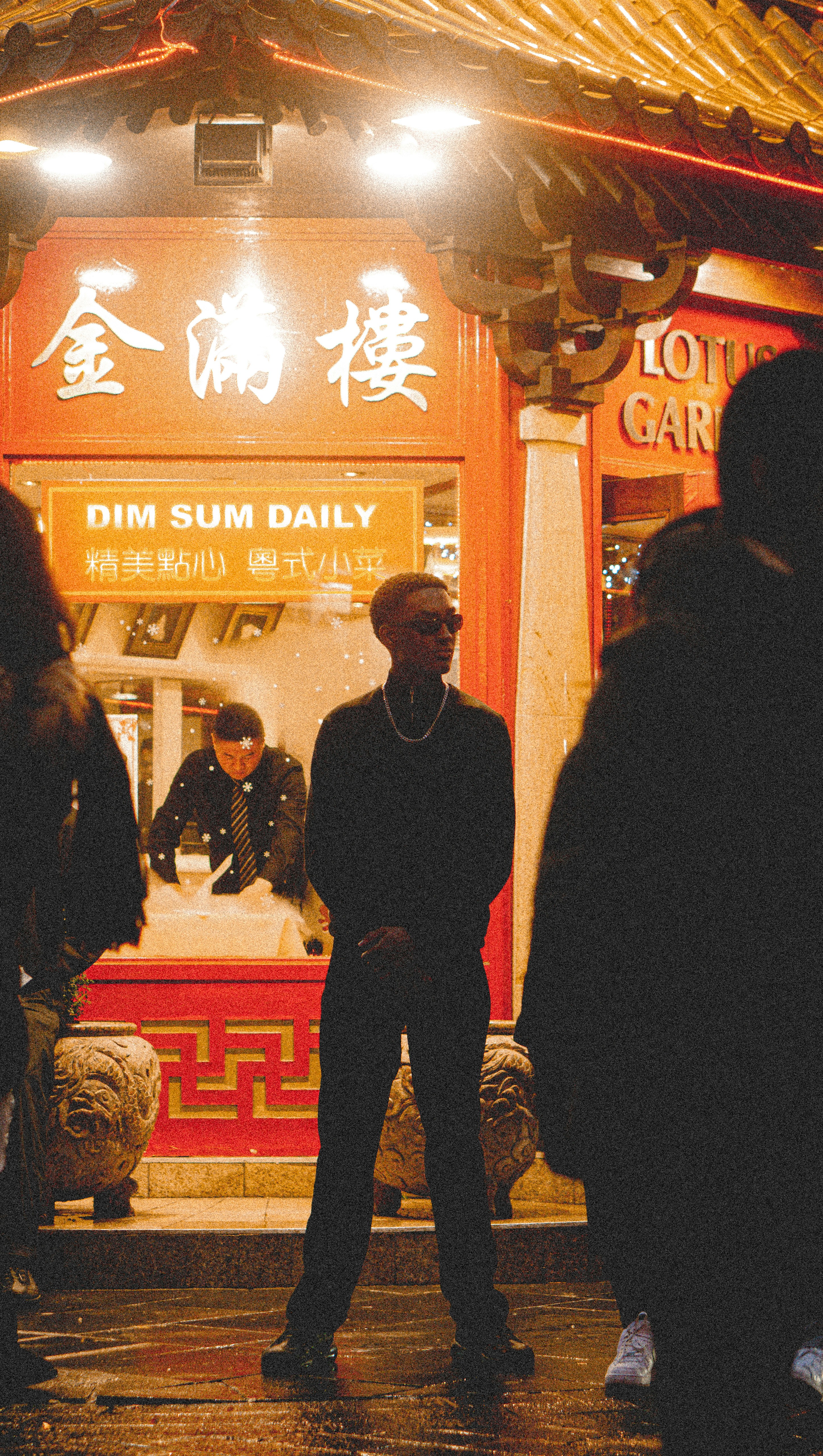 a group of people standing in front of a store