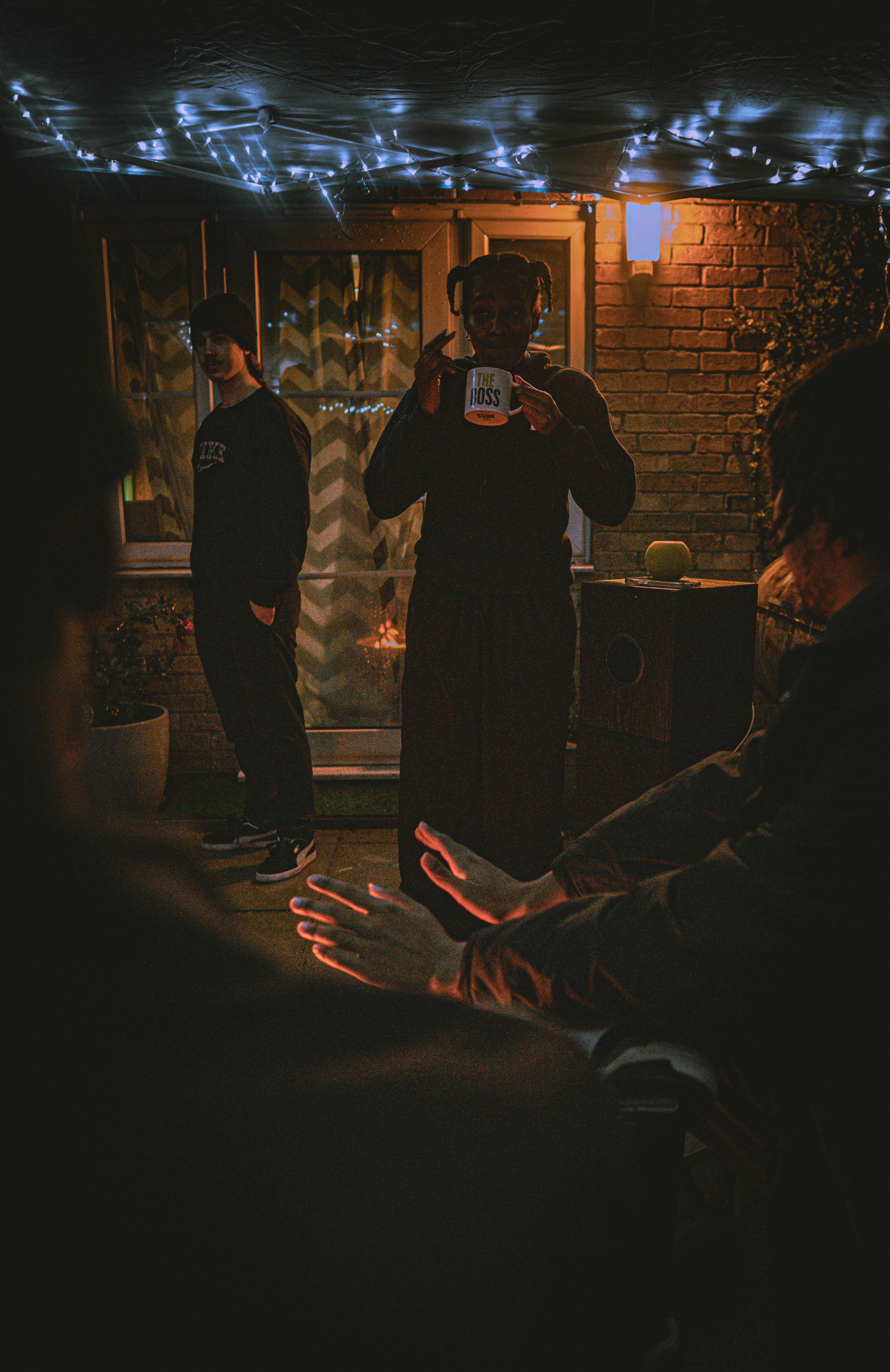 a group of people standing around a room