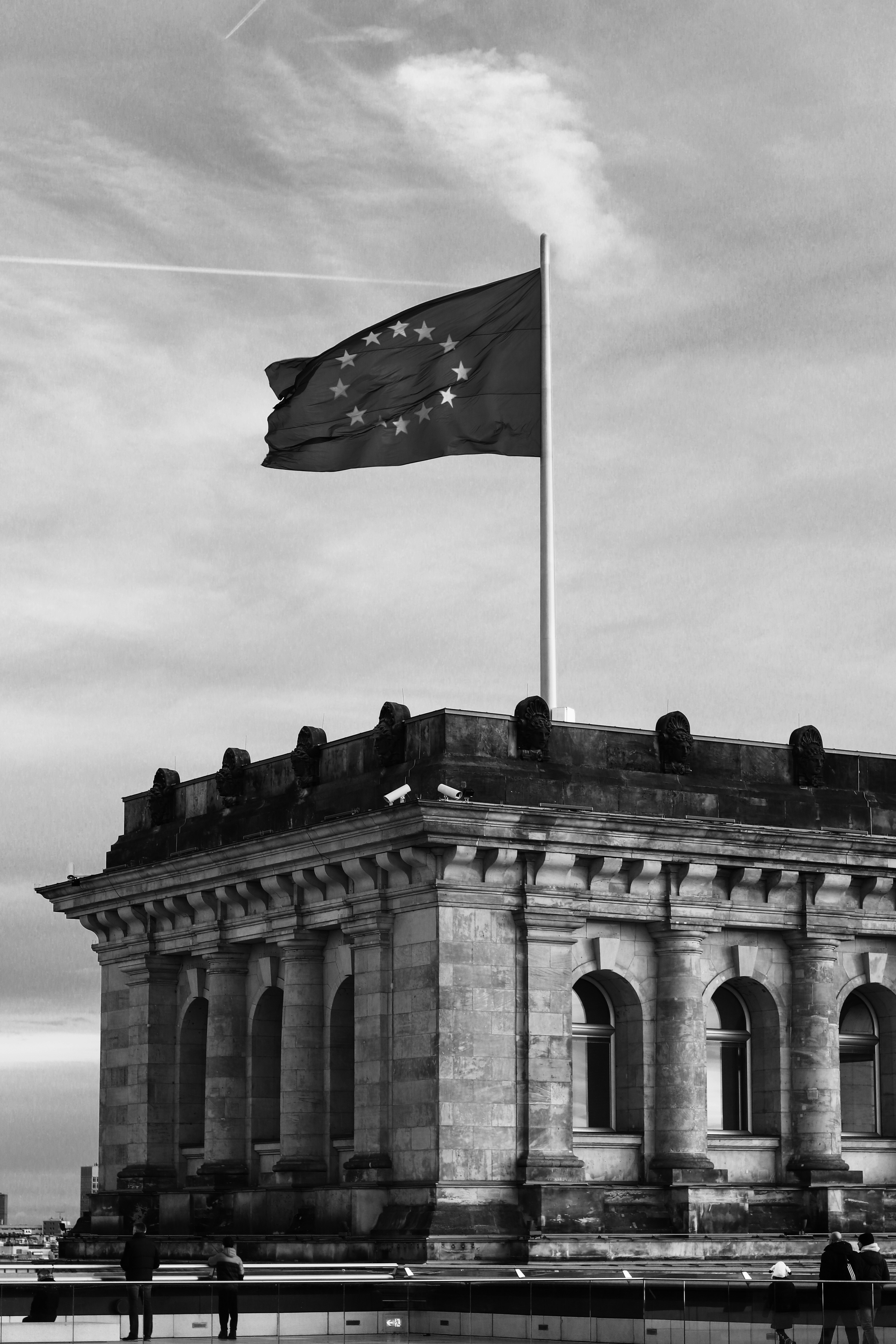 Flag Above the Bastion: Monochrome Confluence of Stone and Sky