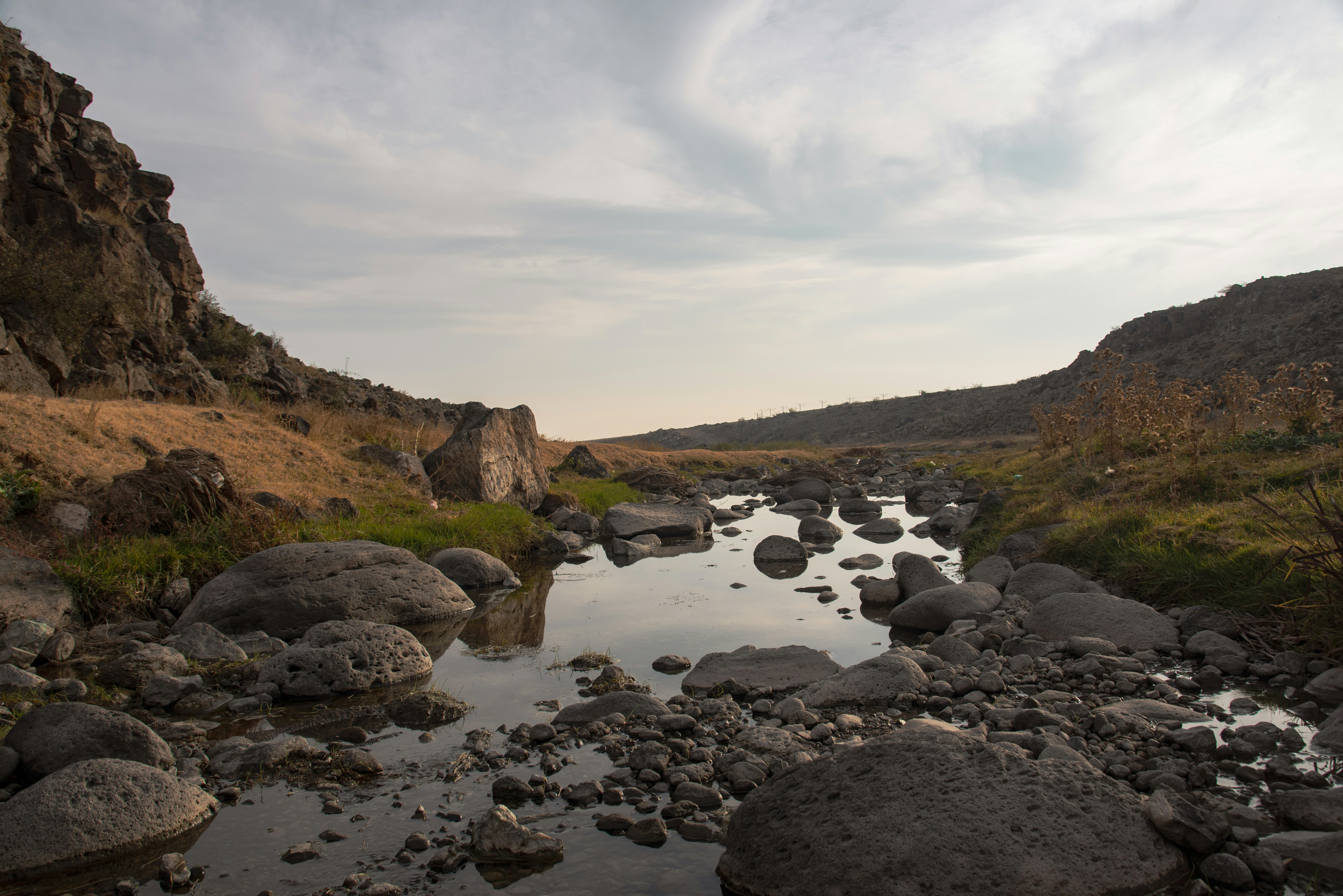 A stream running through a lush green hillside photo – Free Nature ...