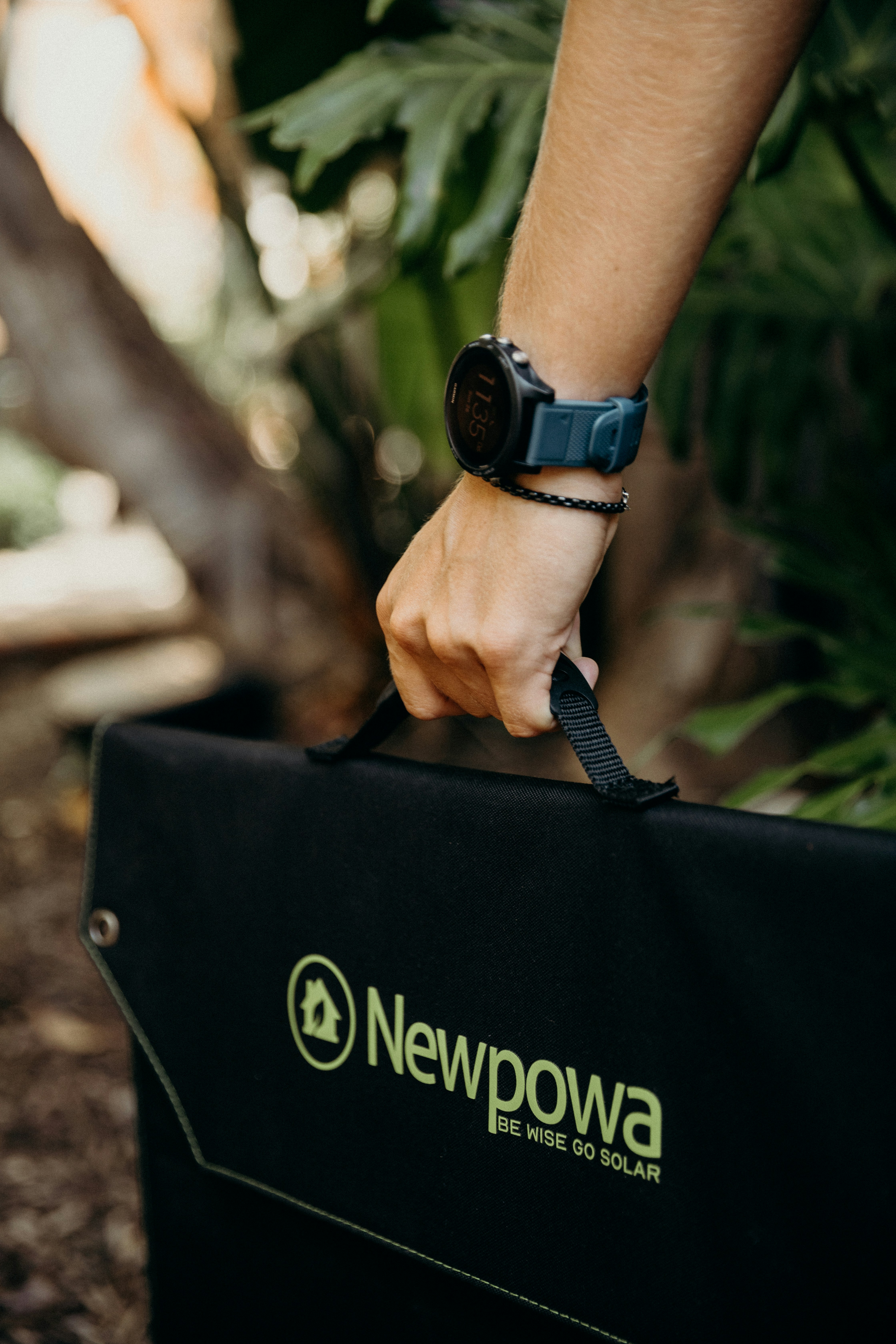 Grasping the Newpowa Solar Bag: A Sunlit Moment on the Trail