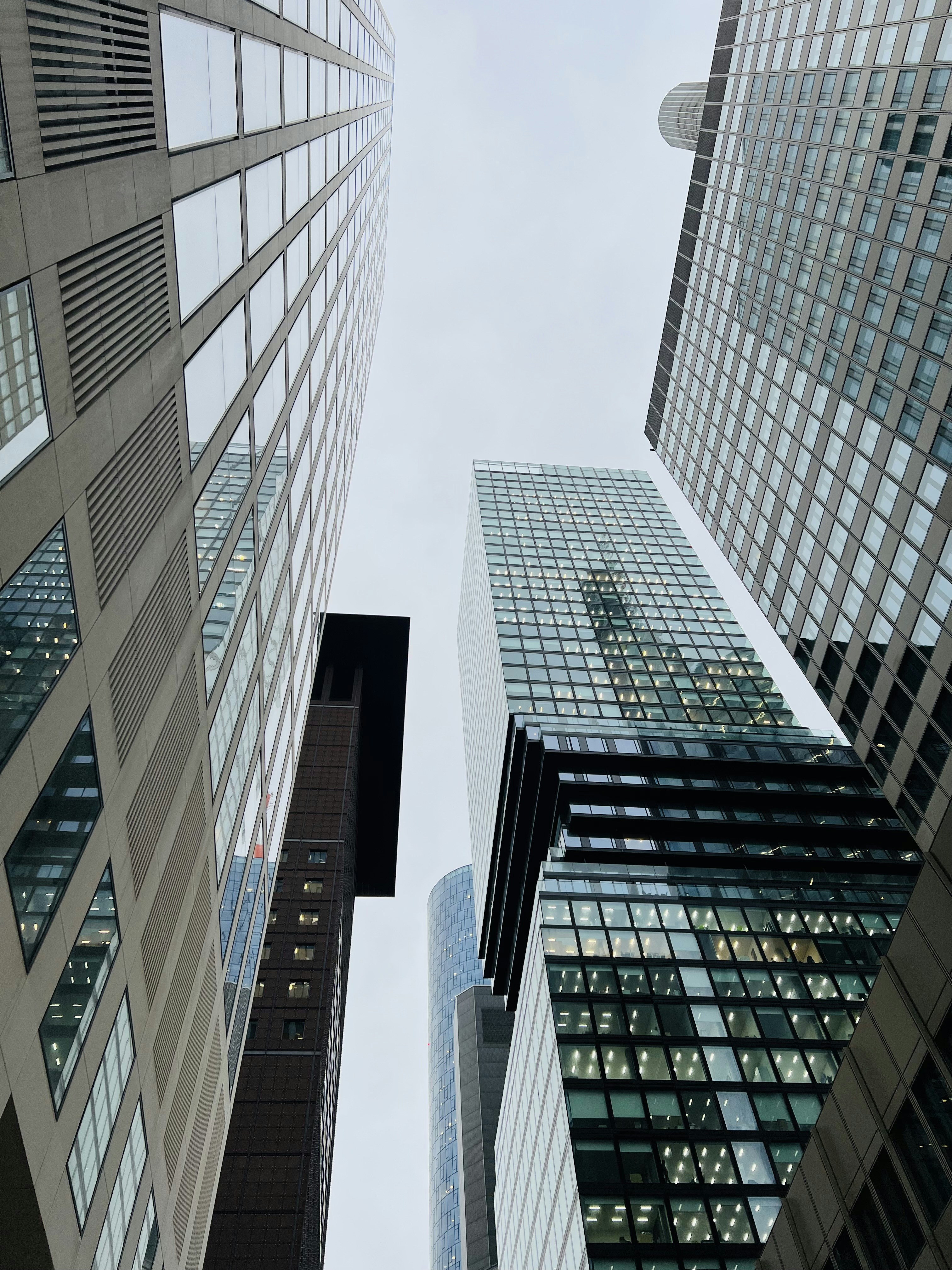 Looking up at tall buildings in a city photo – Free Image on Unsplash