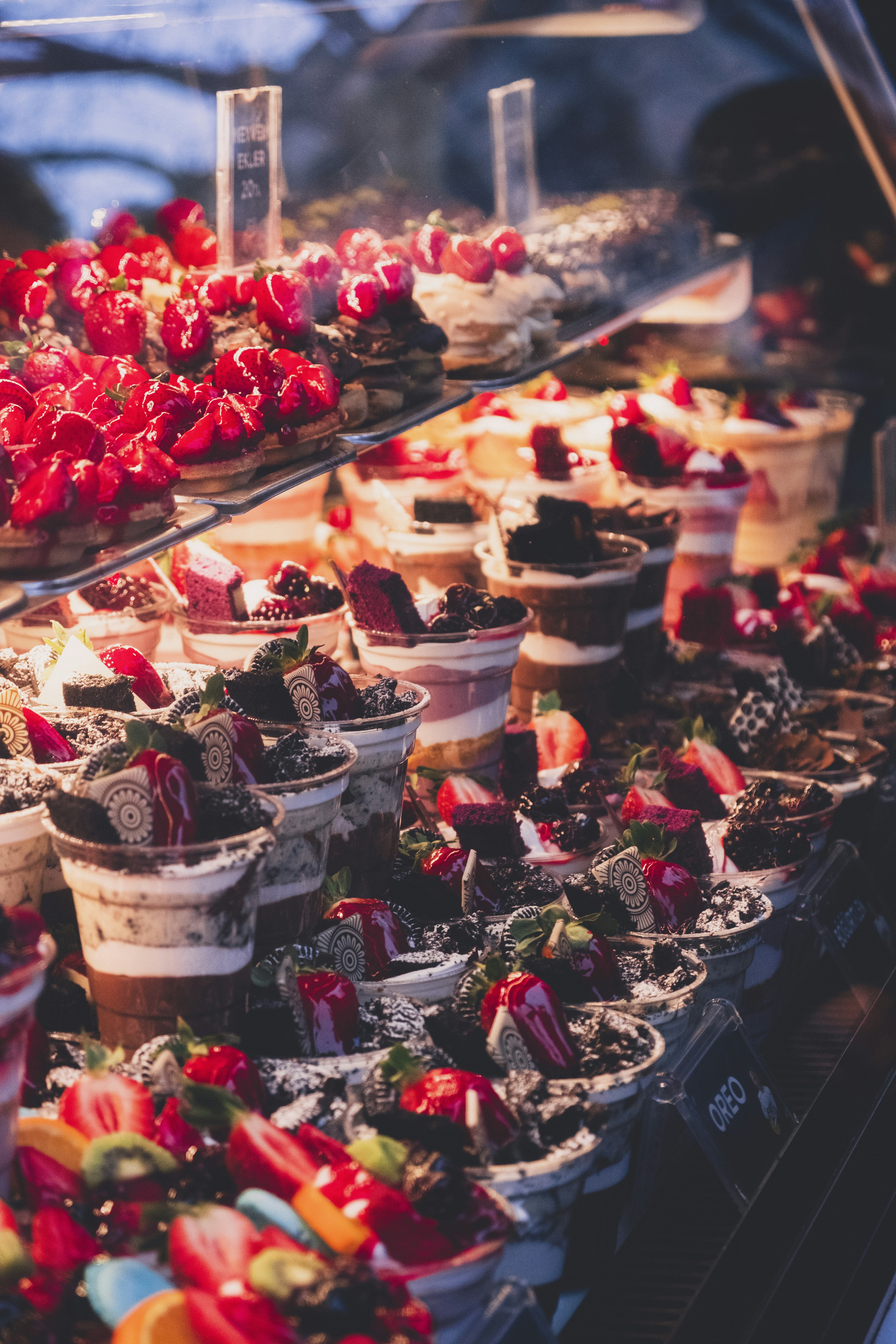 a display case filled with lots of different types of desserts