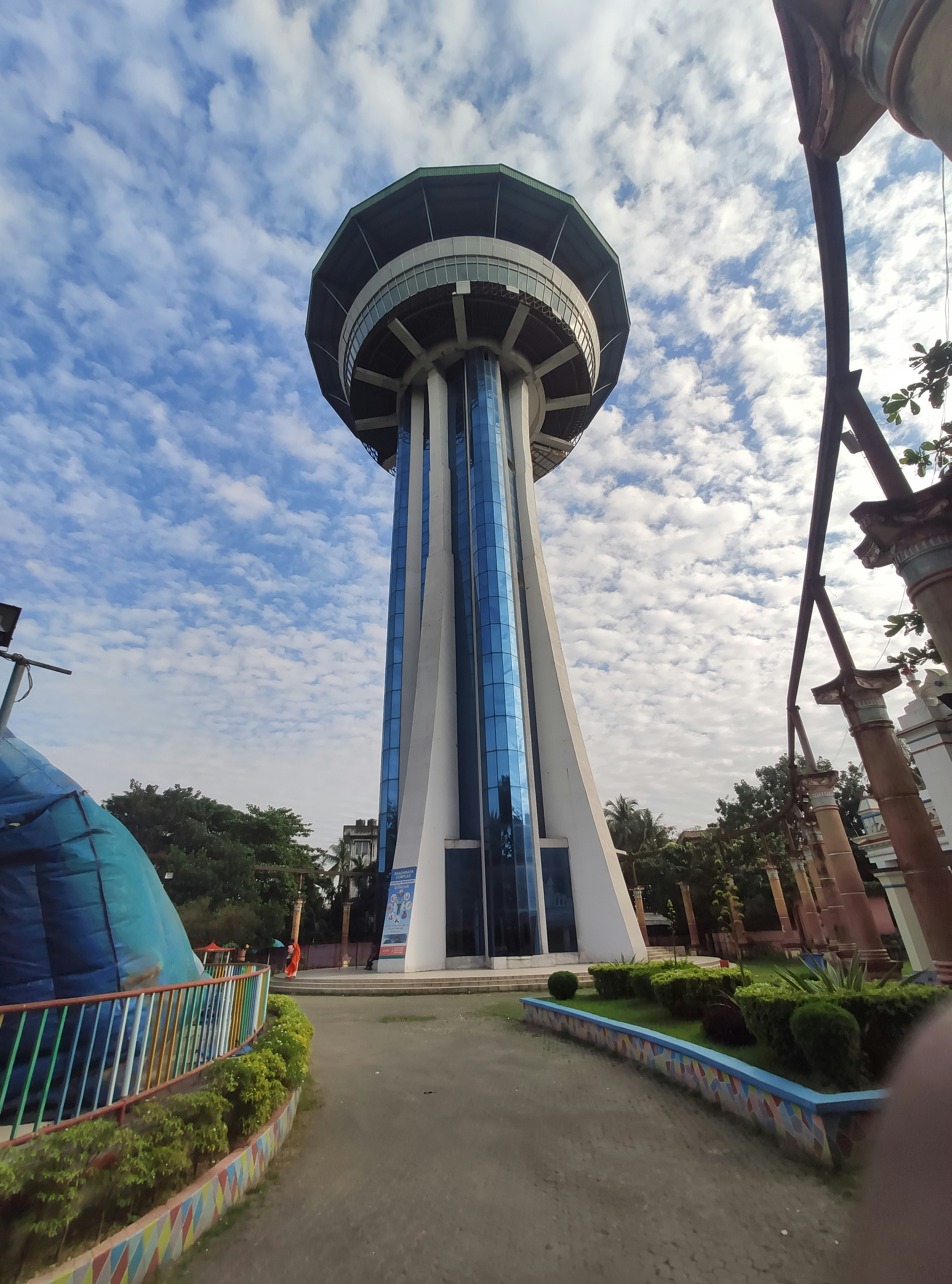 a very tall tower with a sky background