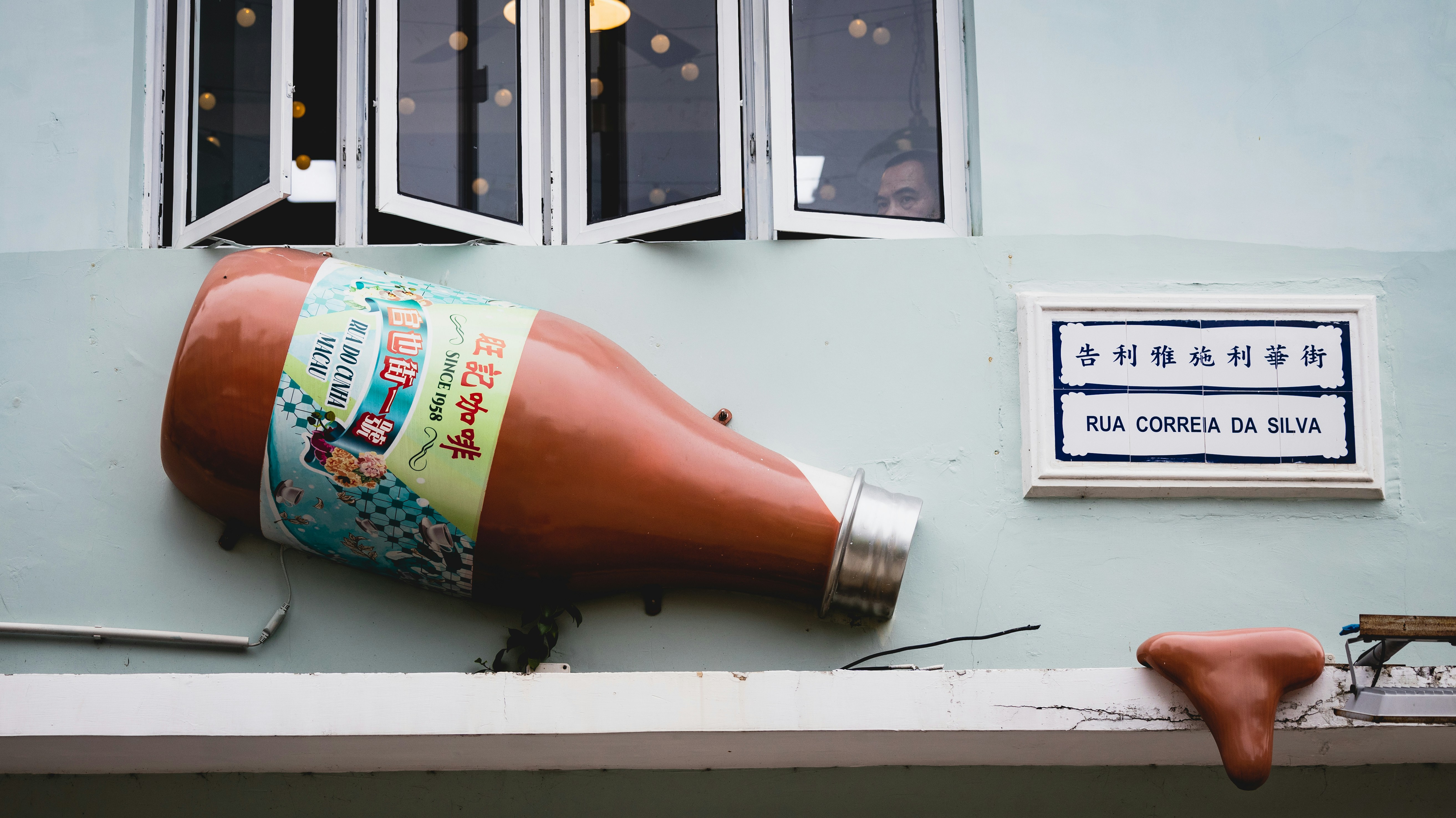 Macau street photo with a coffee brand