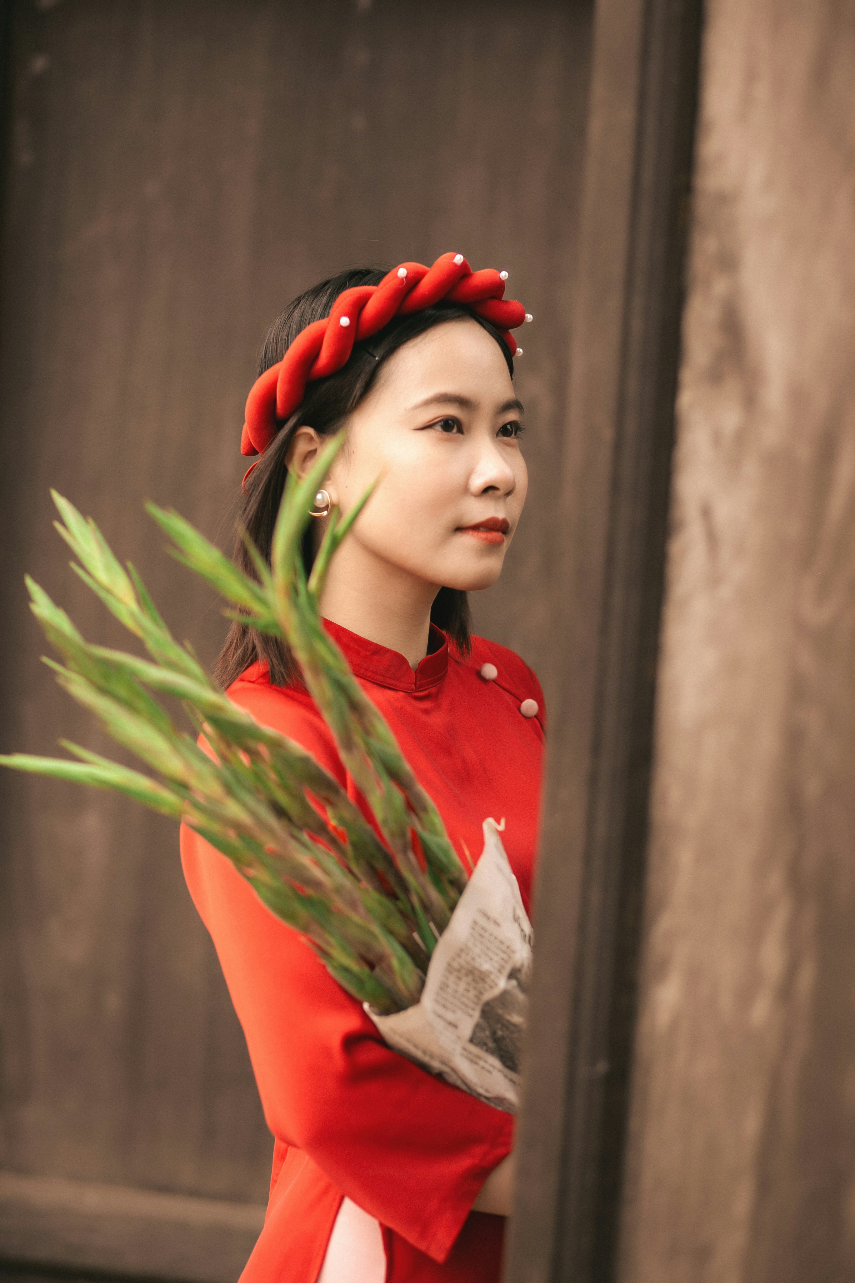 A woman in a red dress holding a plant photo – Free Beautiful girls ...