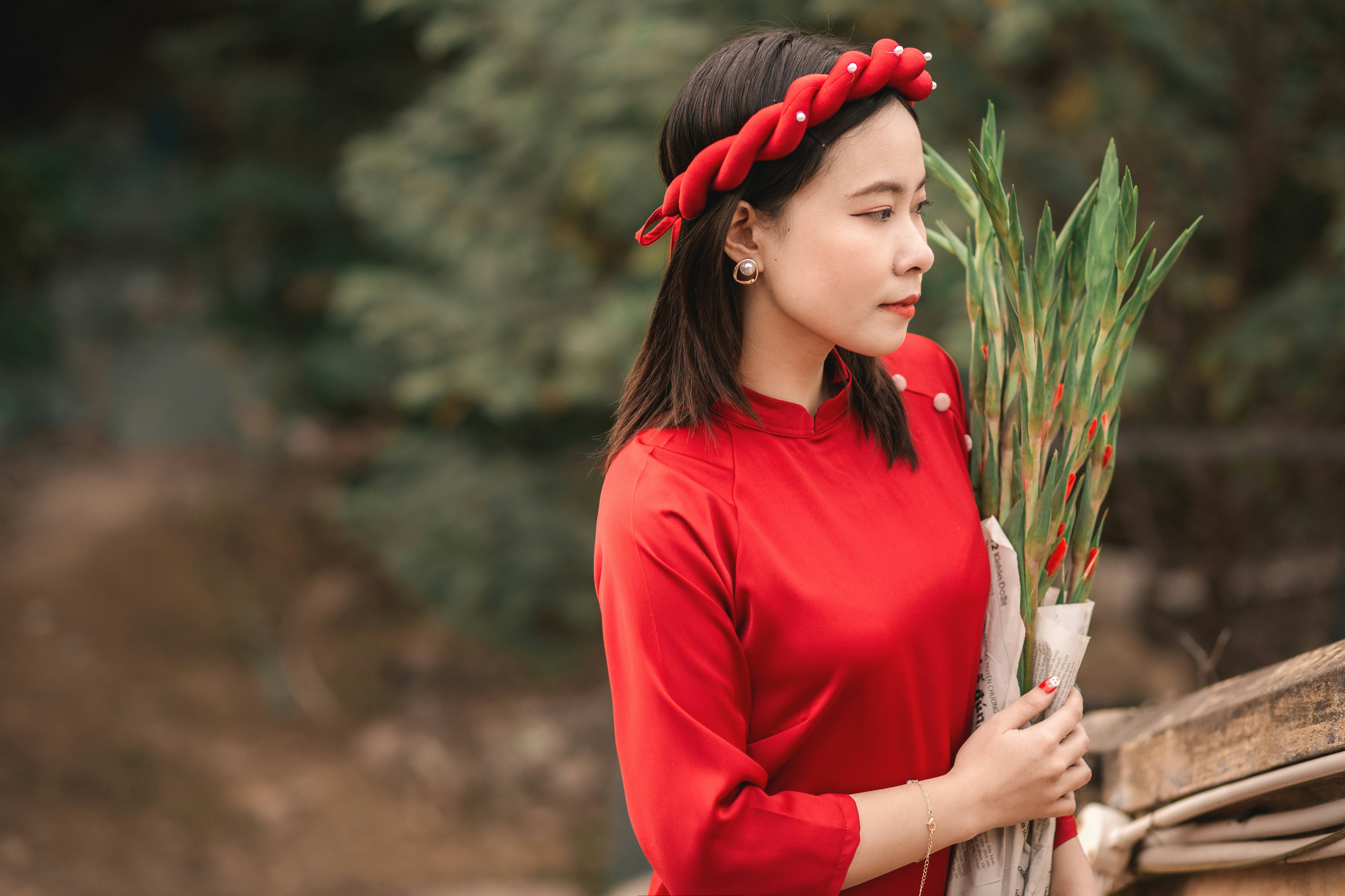 Crimson Reverie: Side Portrait with a Bouquet