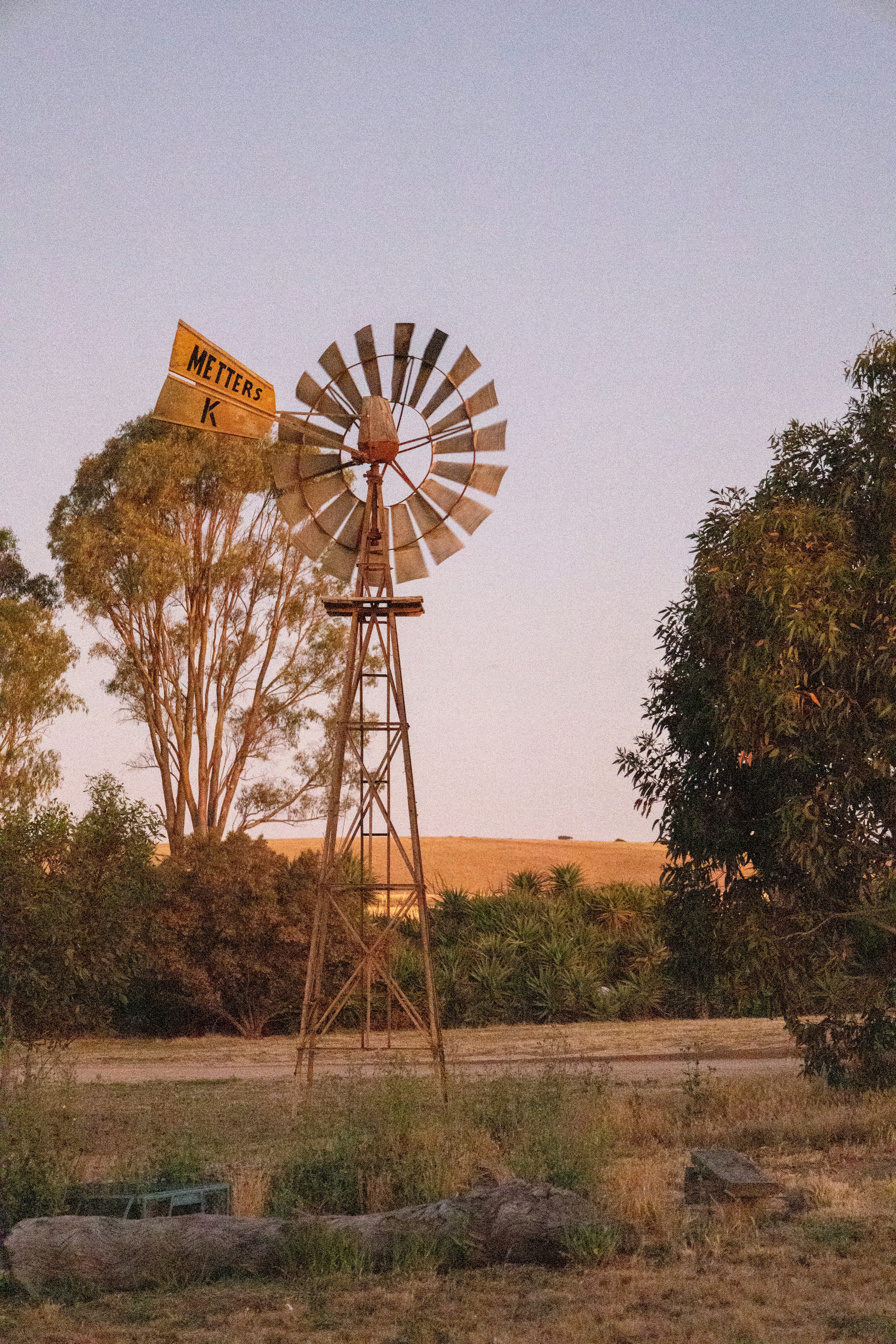 a windmill with a sign on top of it