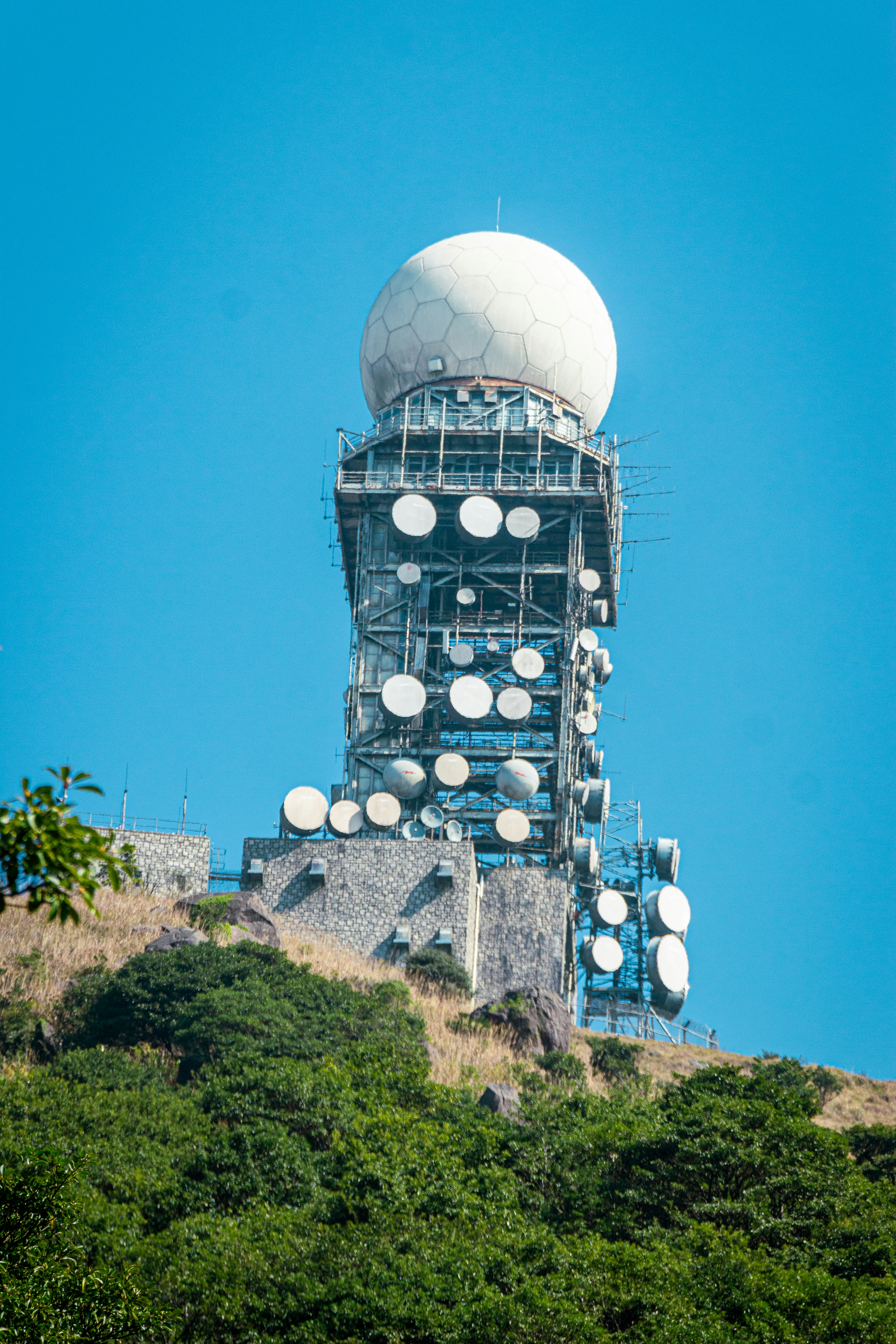 a very tall tower with a lot of antennas on top of it