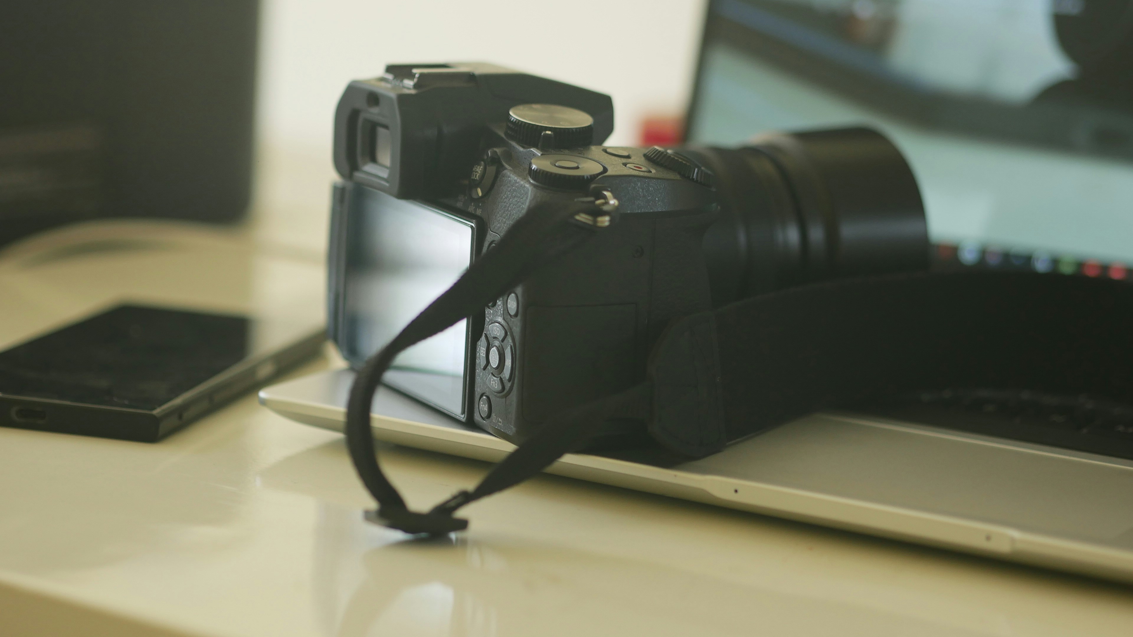 Tech Workspace Harmony: Camera Meets Laptop