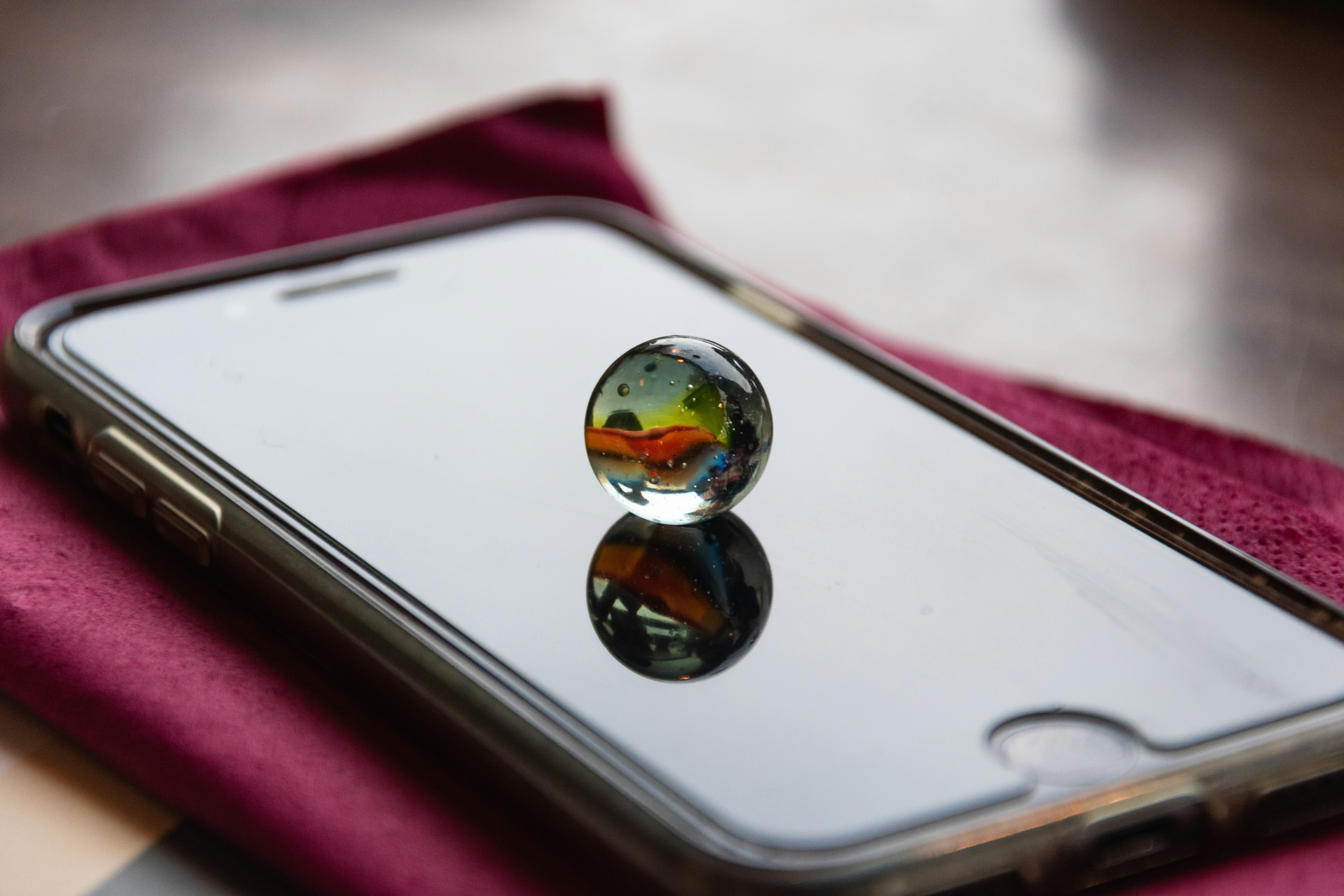A cell phone with a glass ball on top of it photo – Free Electronics ...