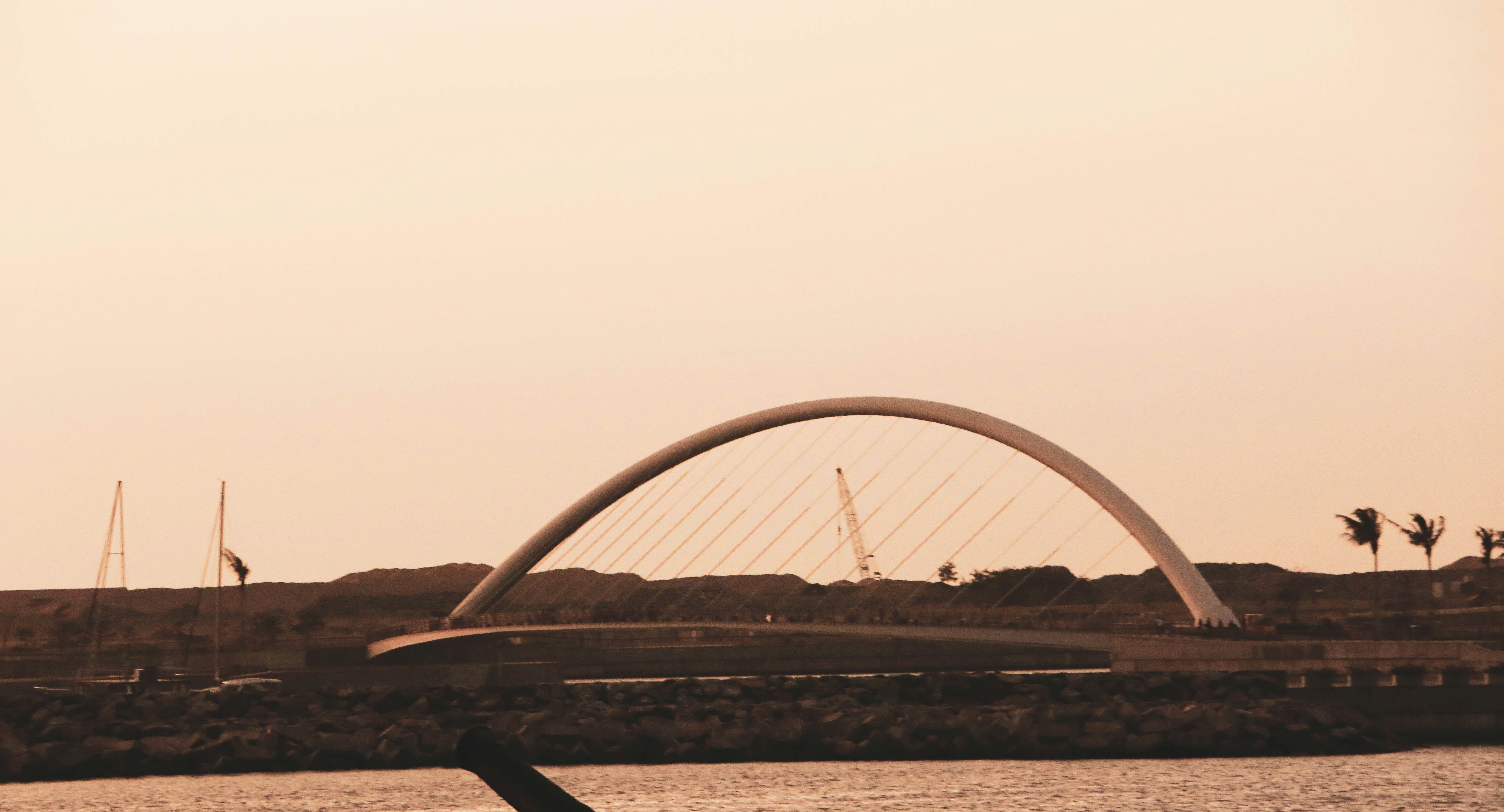 Arc of Silence: Sunset Arch Framing a Quiet Waterfront