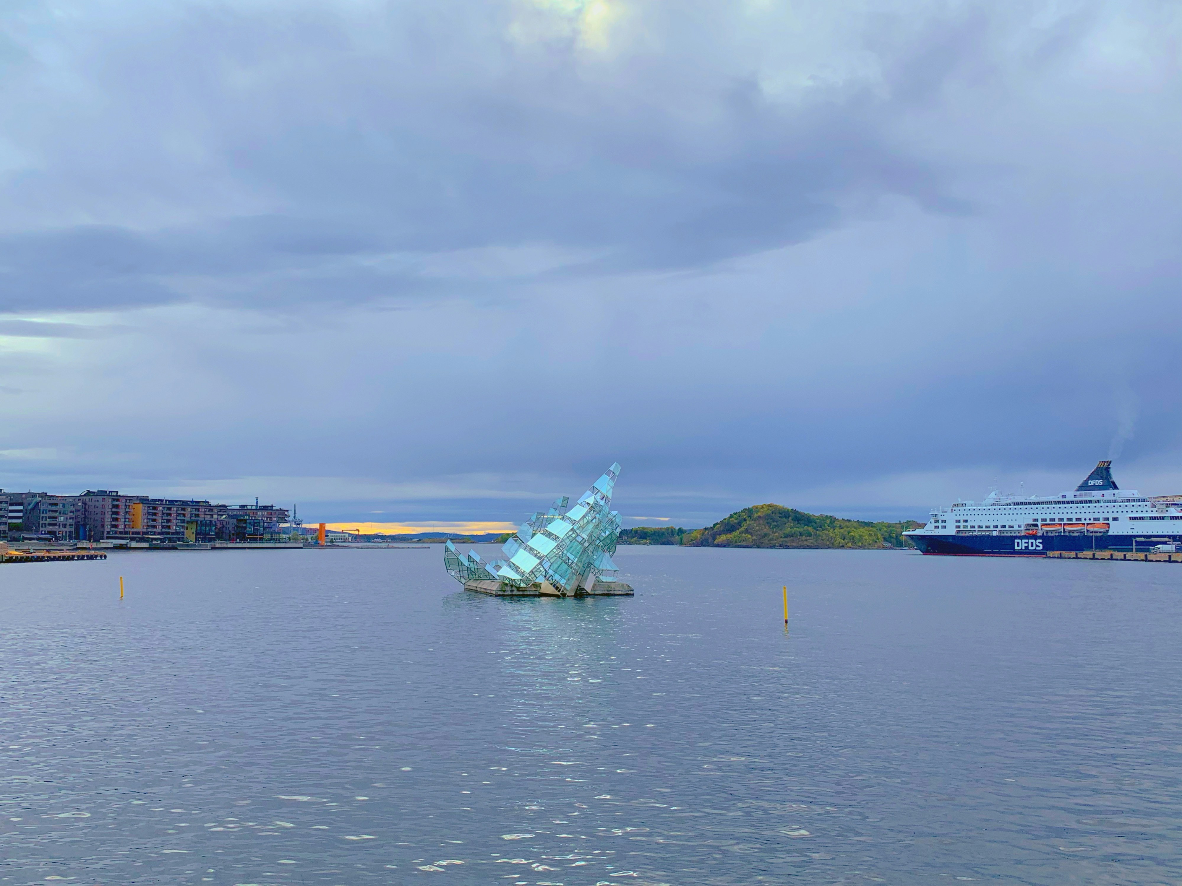 Liquid Glass: Ice Sculpture Drifts in a Nordic Harbor