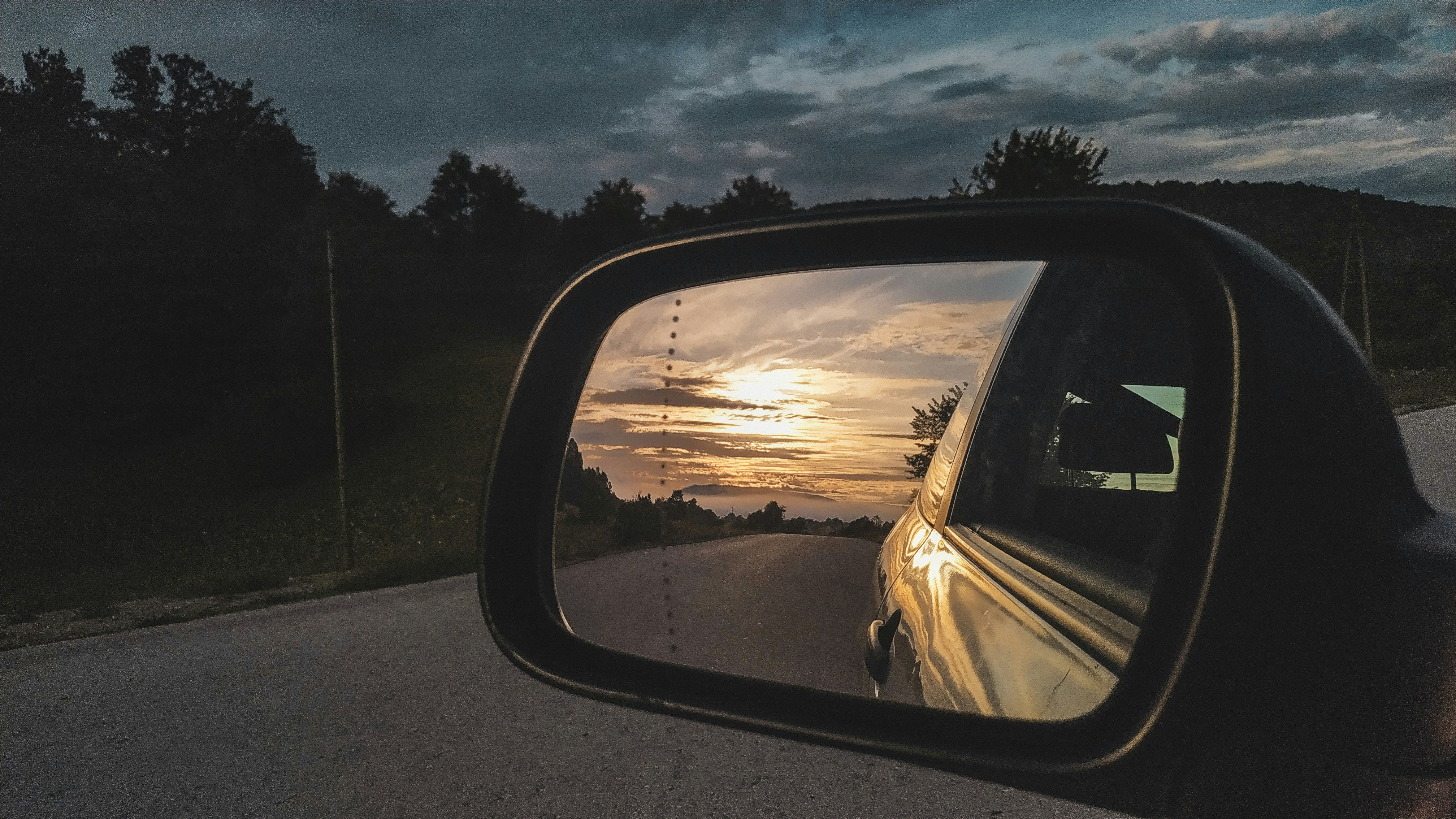 A rear view mirror on a car reflecting a sunset photo – Free Bihać ...