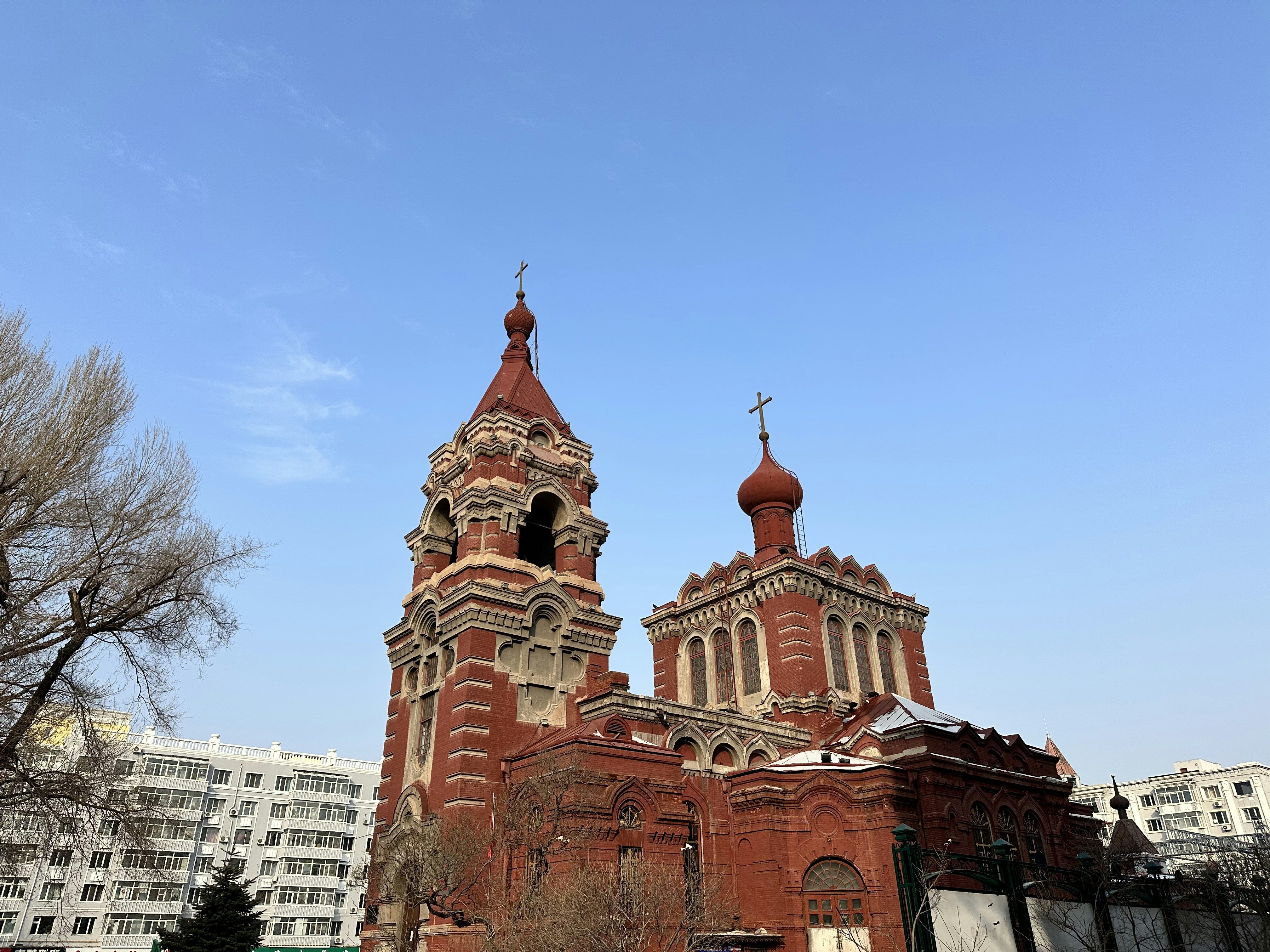 A large church with two towers and a cross on top photo – Free Church ...