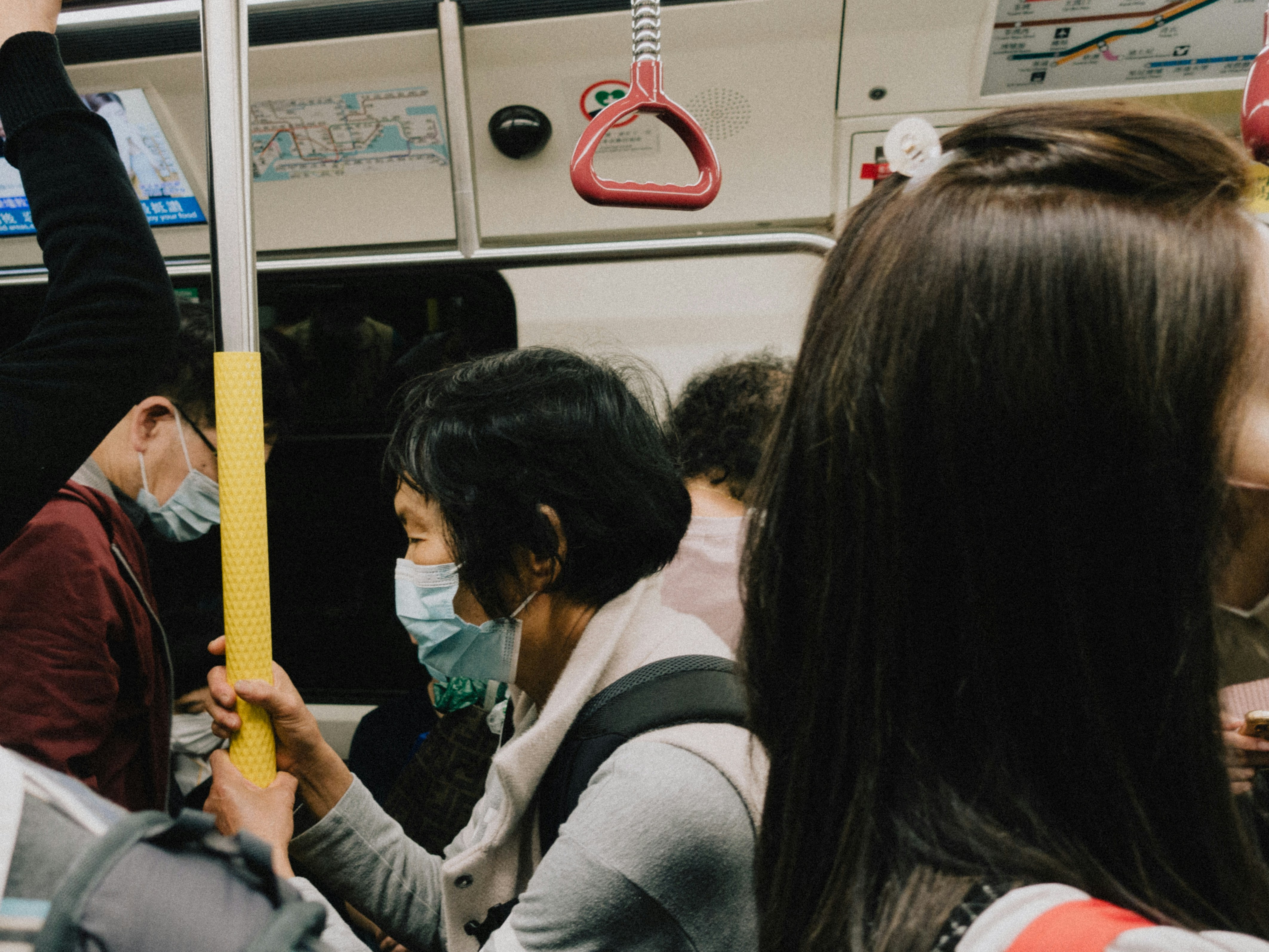 Masked Commuter Moment: Quiet Focus Amid Subwaysmiles