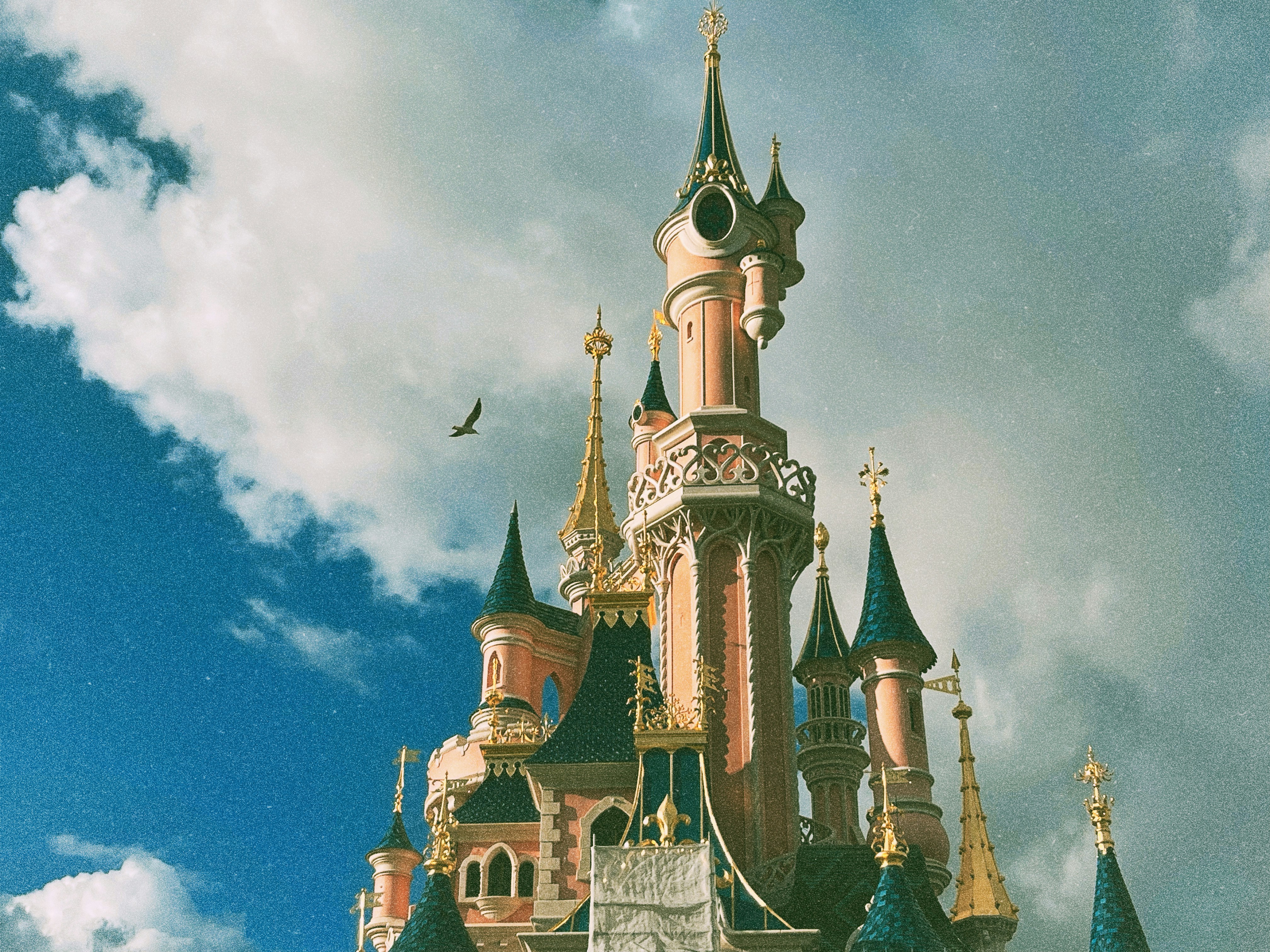 Spire Crest of a Fairy-Tale Castle Under Cerulean Skies