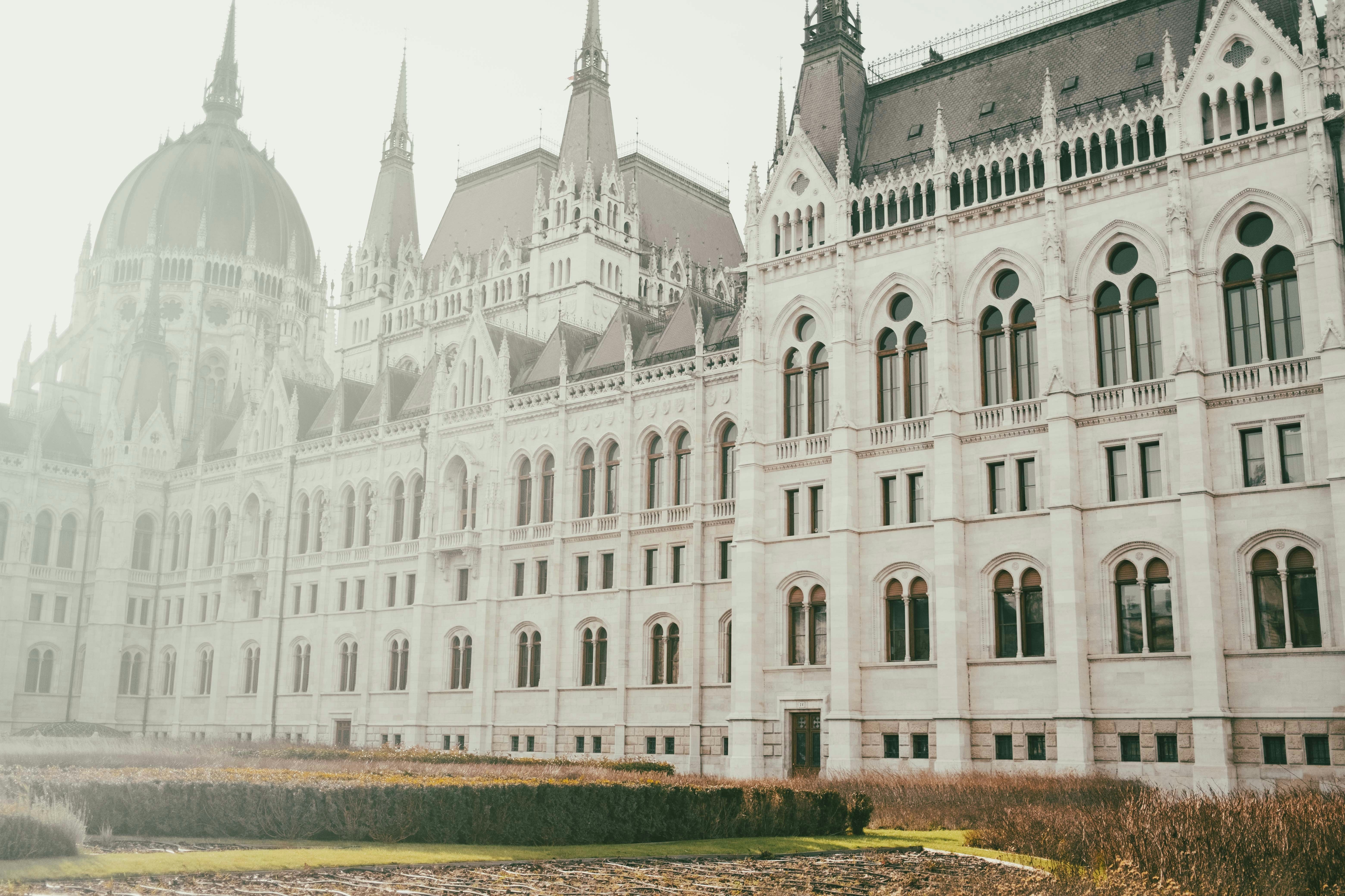 A large white building with a clock tower photo – Free Budapest Image ...
