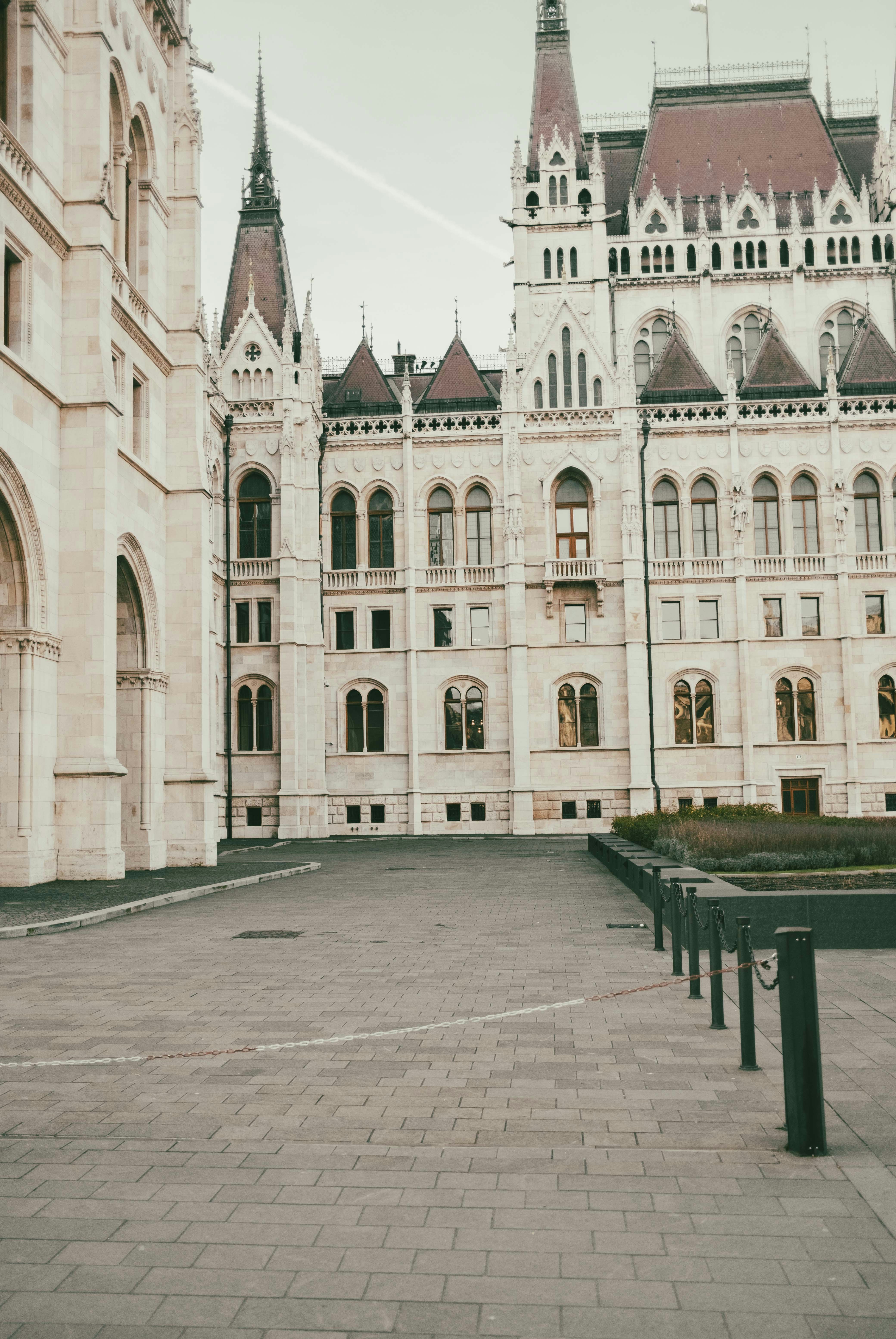 A large building with a clock tower on top of it photo – Free Budapest ...