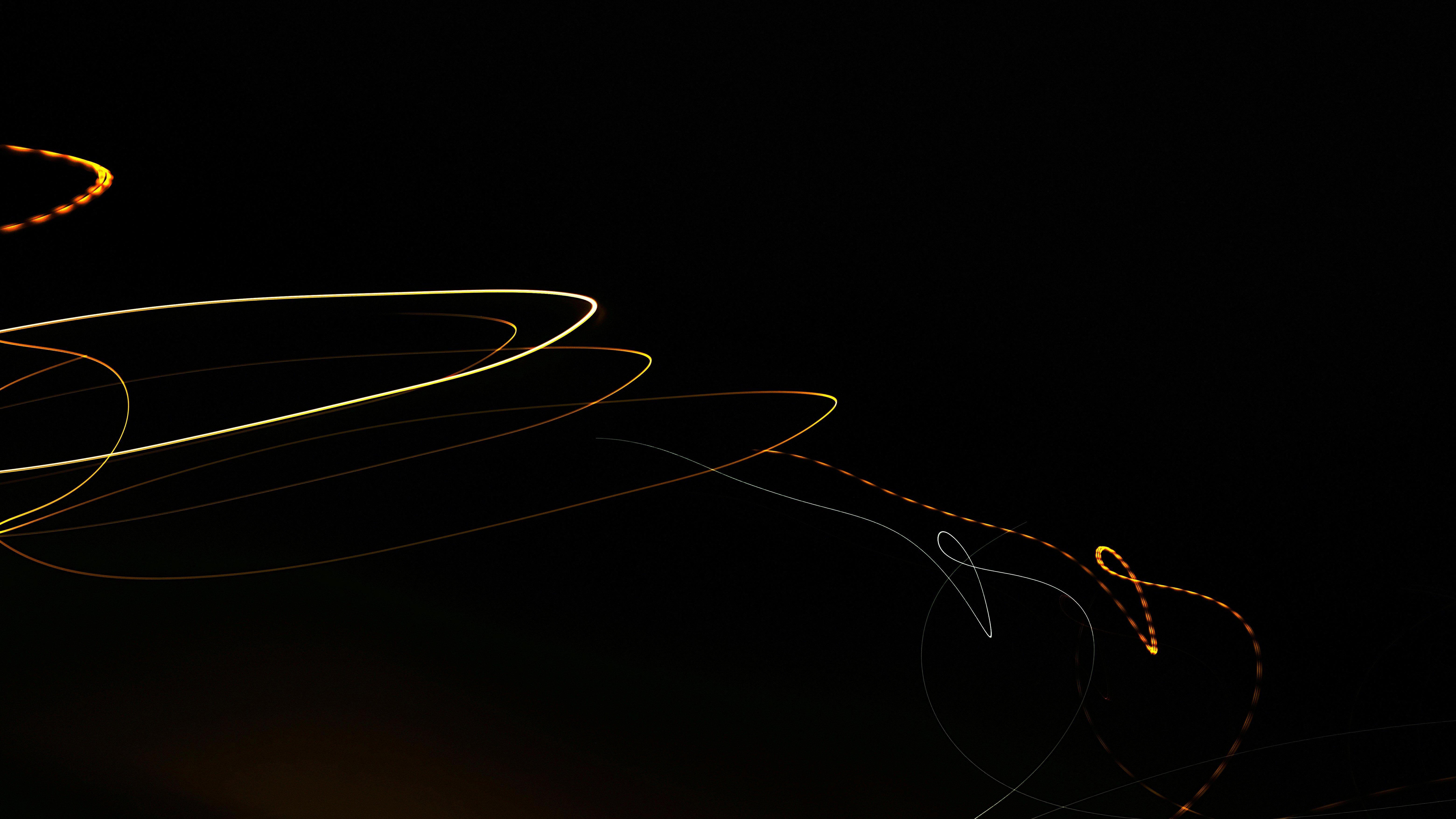A circular ripple of light yellow and orange light.