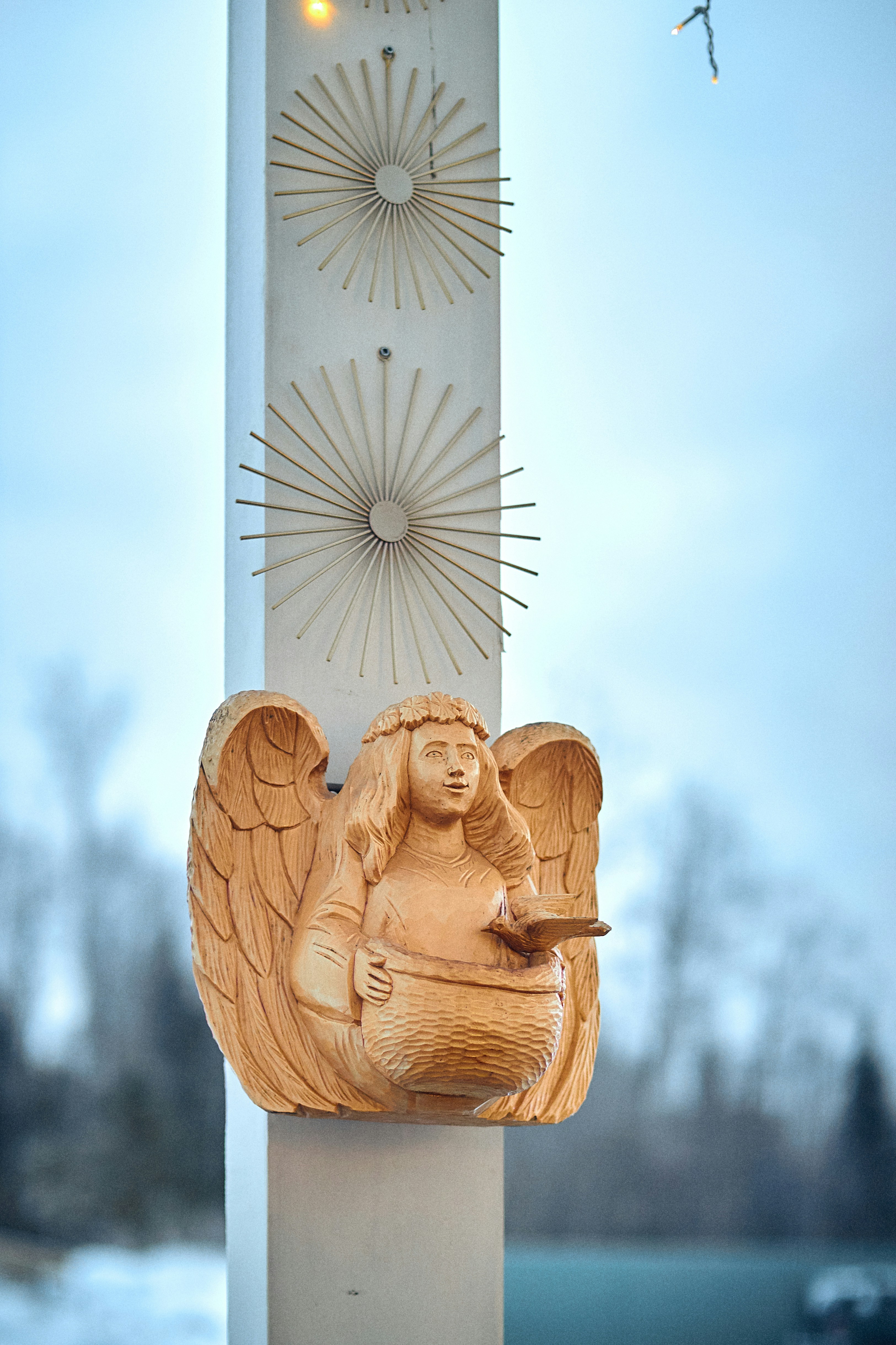 a statue of an angel holding a guitar