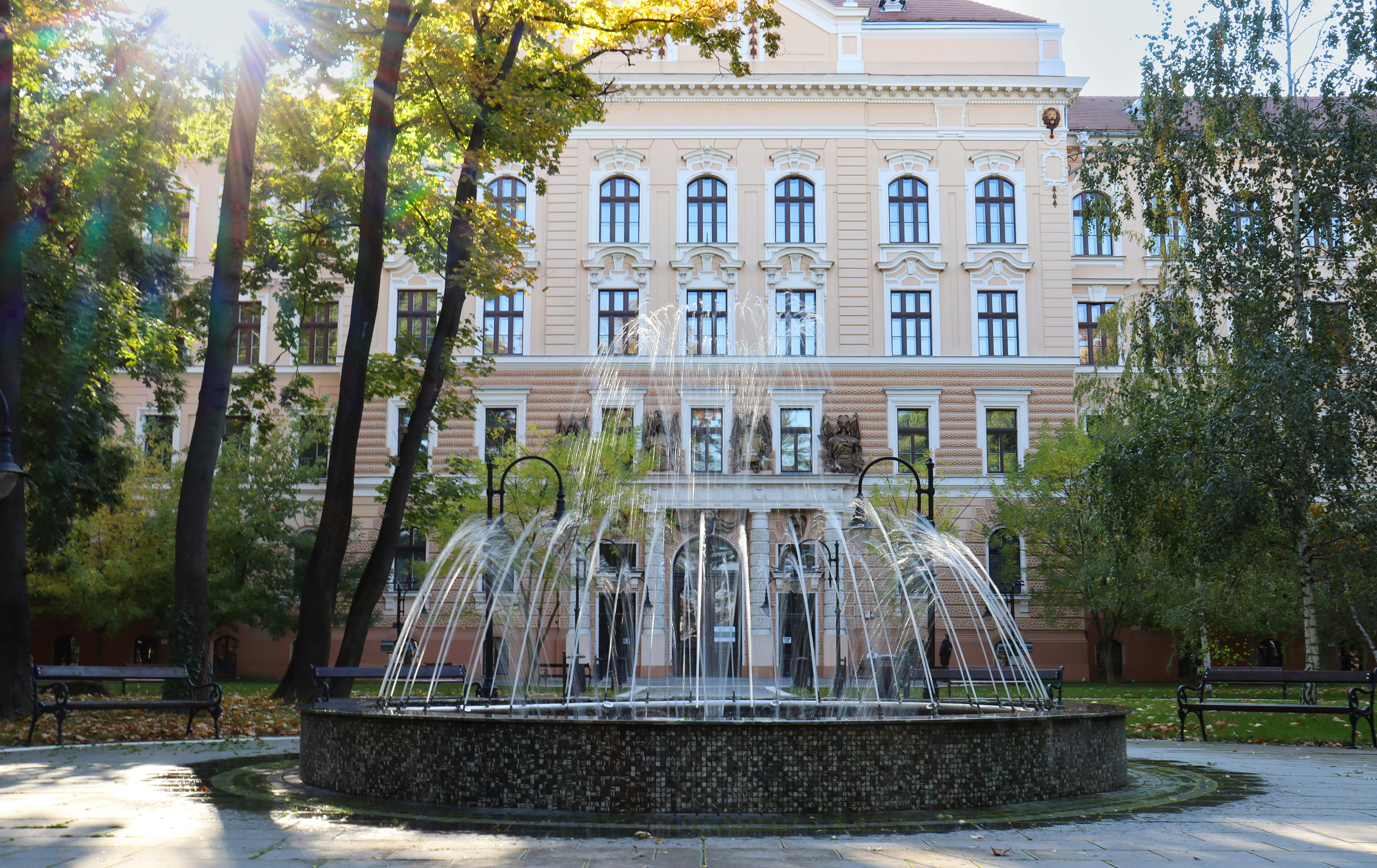 Arched Fountain in a Sunlit Neoclassical Courtyard