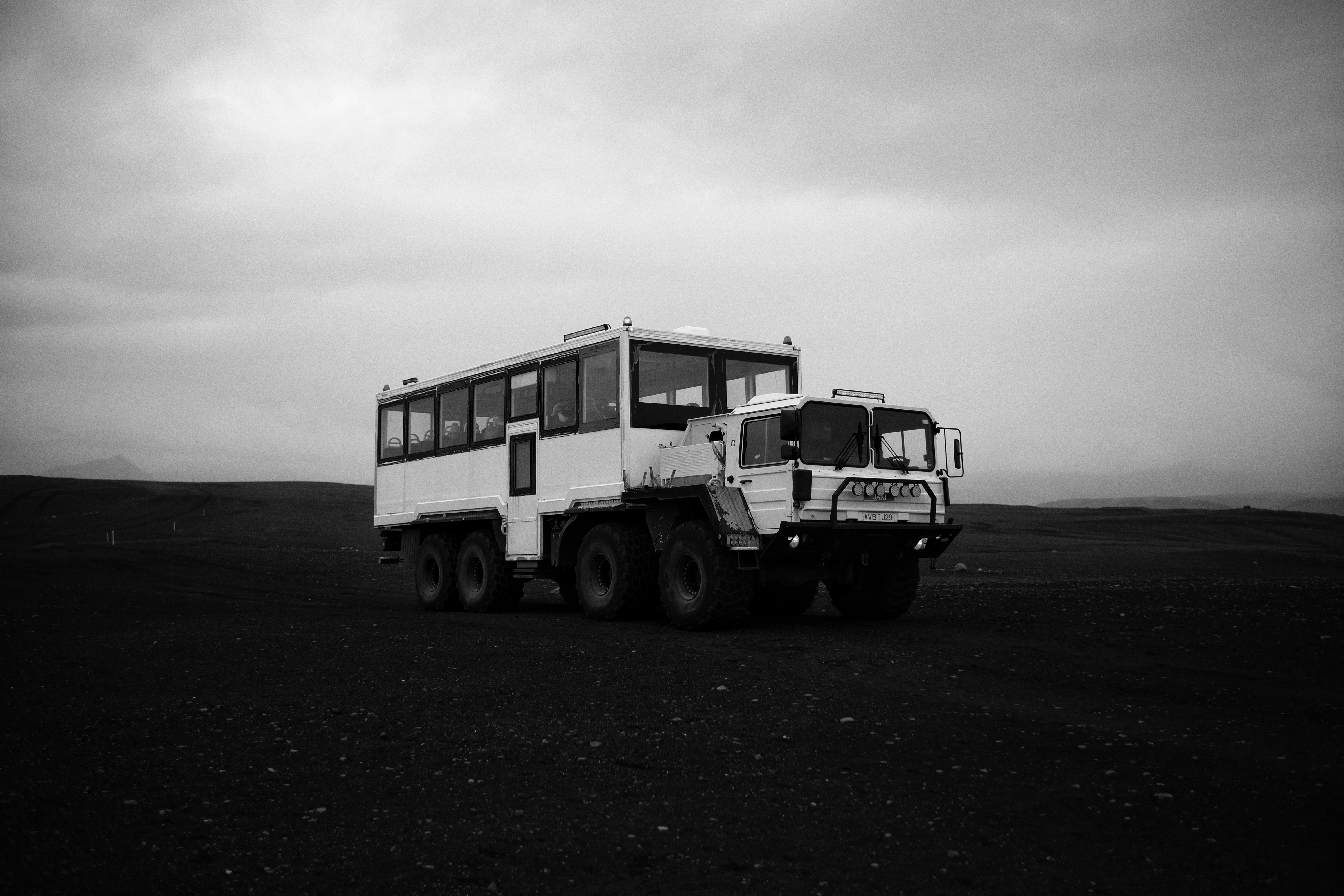 Midnight Bus on a Black Sand Plain