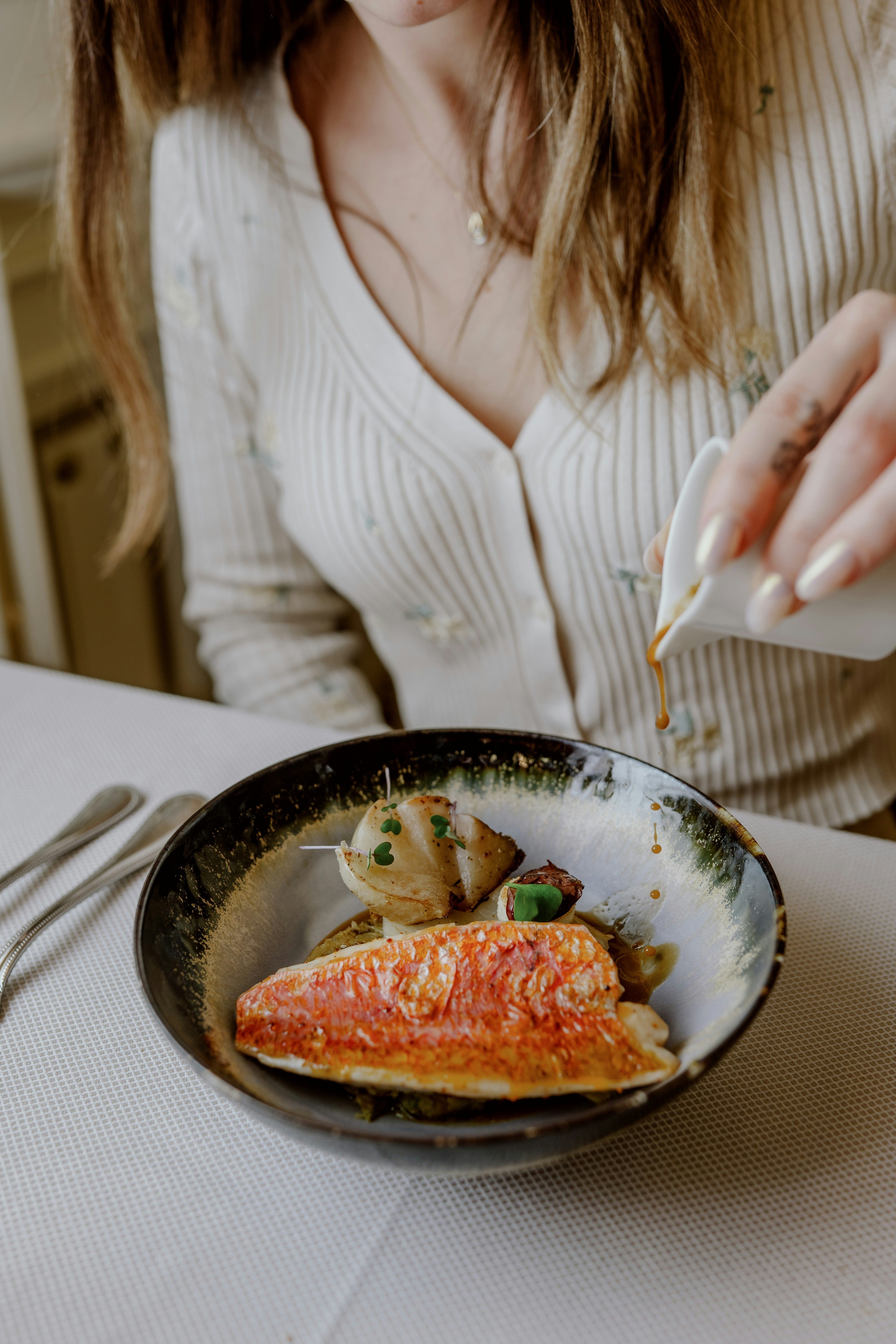 Sauce Drizzle over Salmon: A Quiet Tabletop Moment
