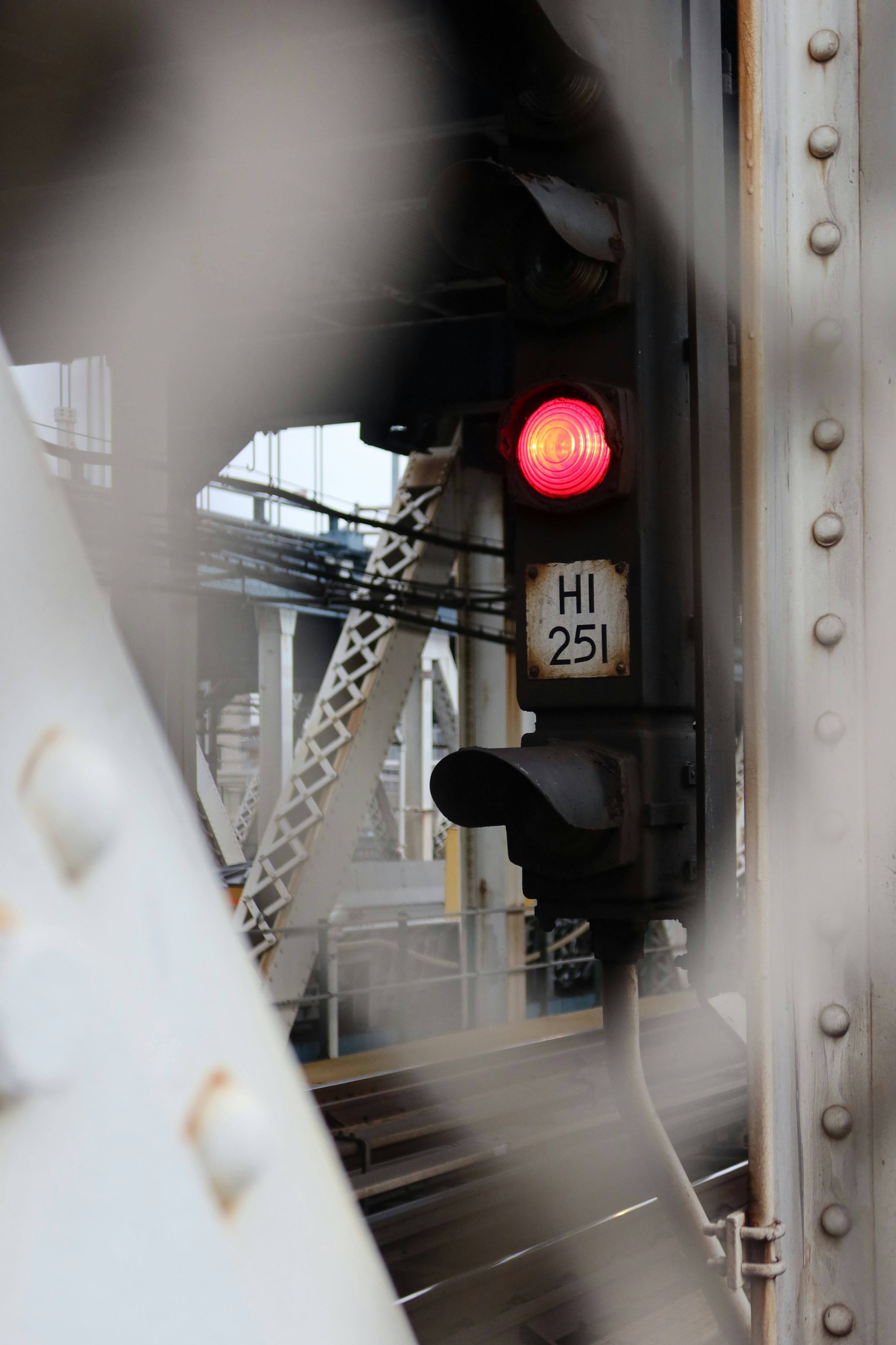 A red traffic light sitting on the side of a train photo – Free Traffic ...