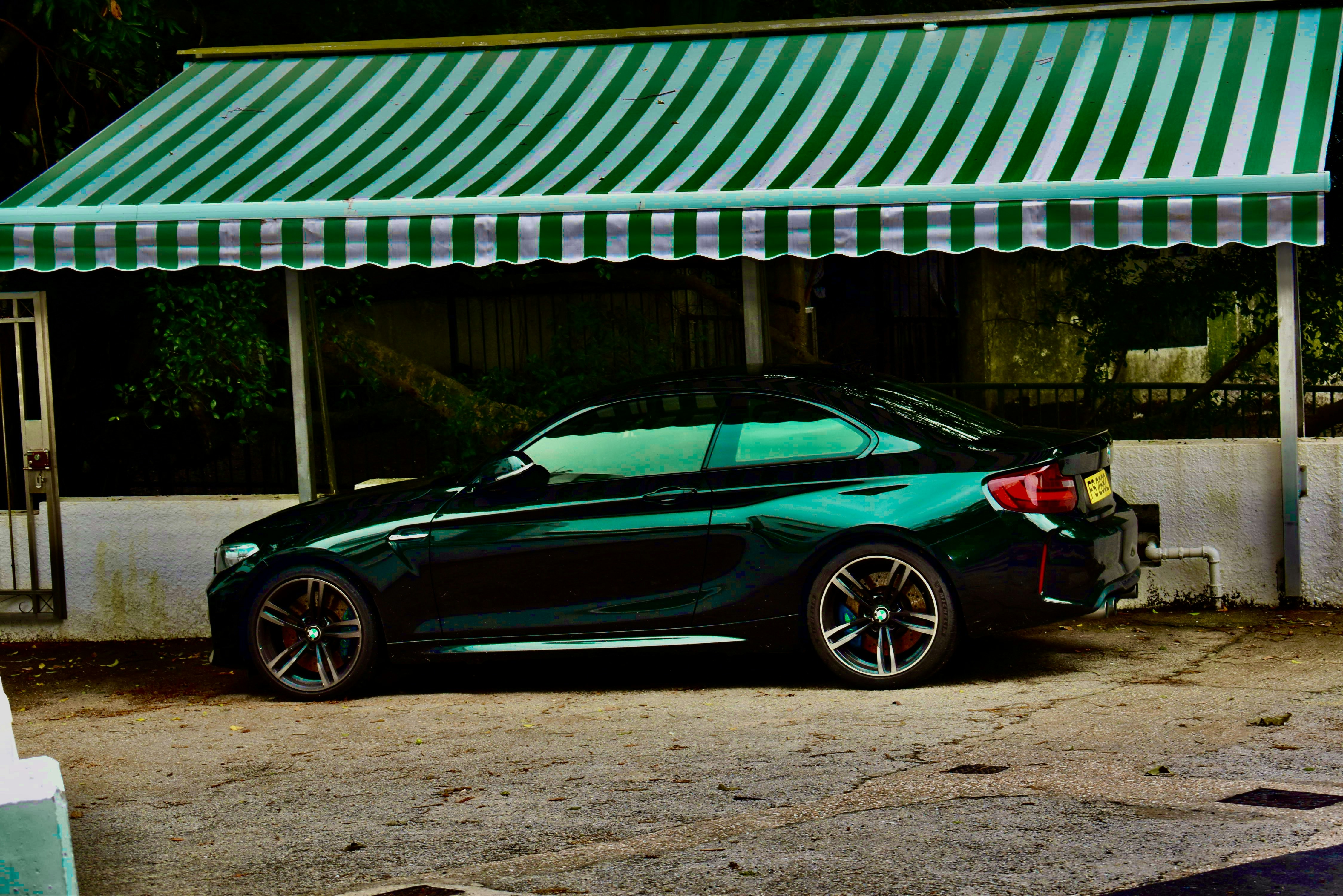 Emerald Speedster under a Striped Canopy