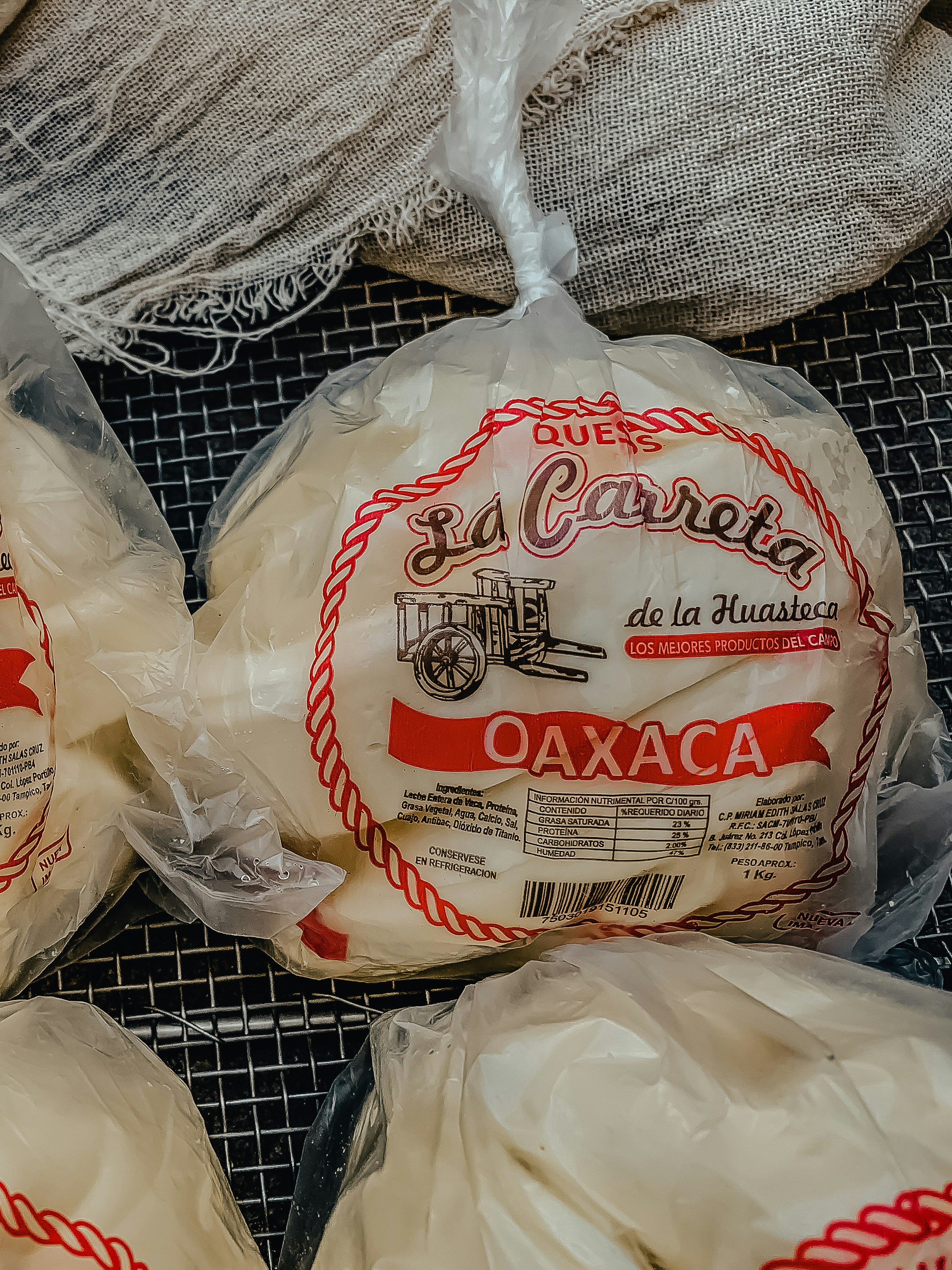 A couple of bags of cheese sitting on top of a table photo – Free Food ...