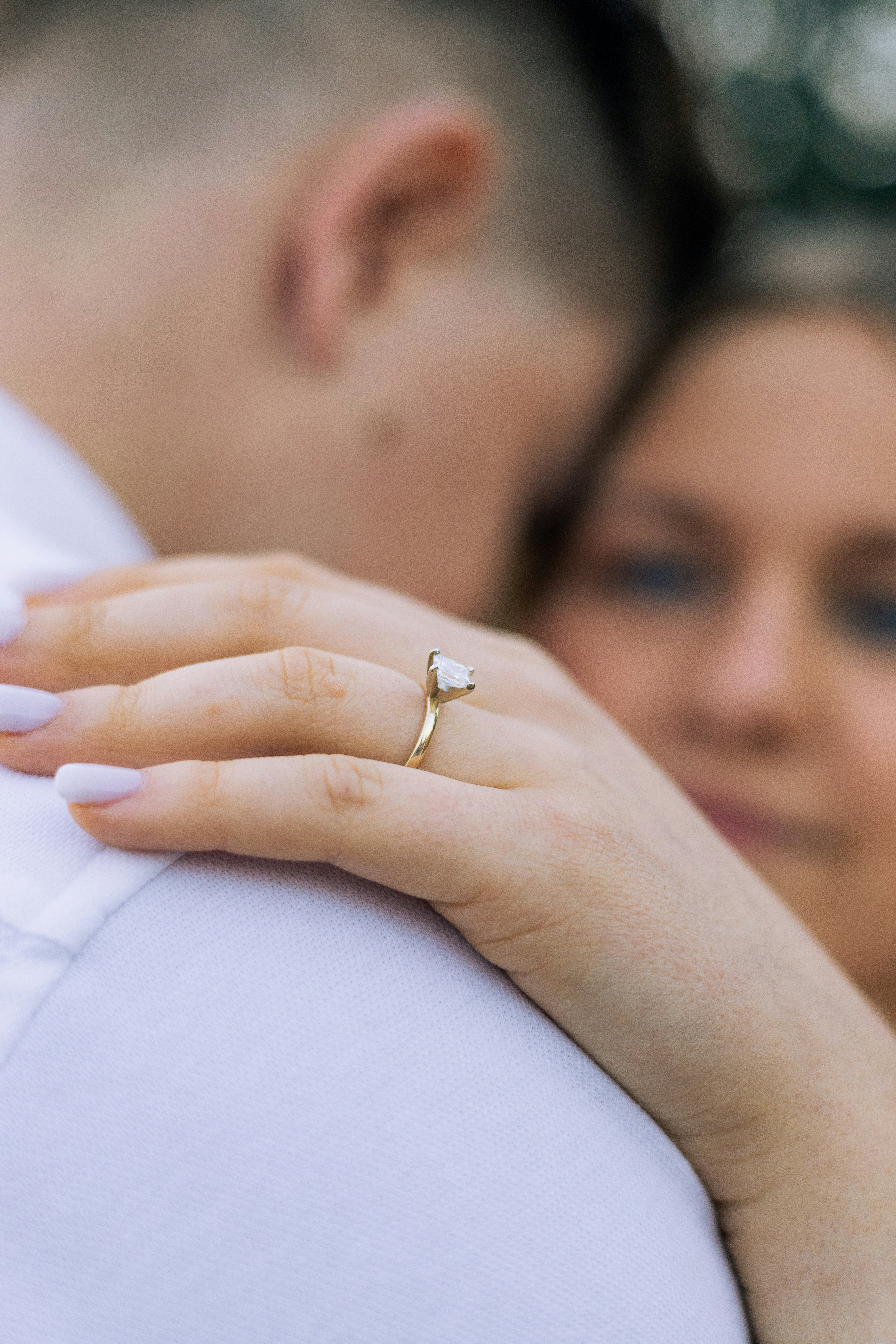 A close up of a person holding a ring photo – Free North america Image ...