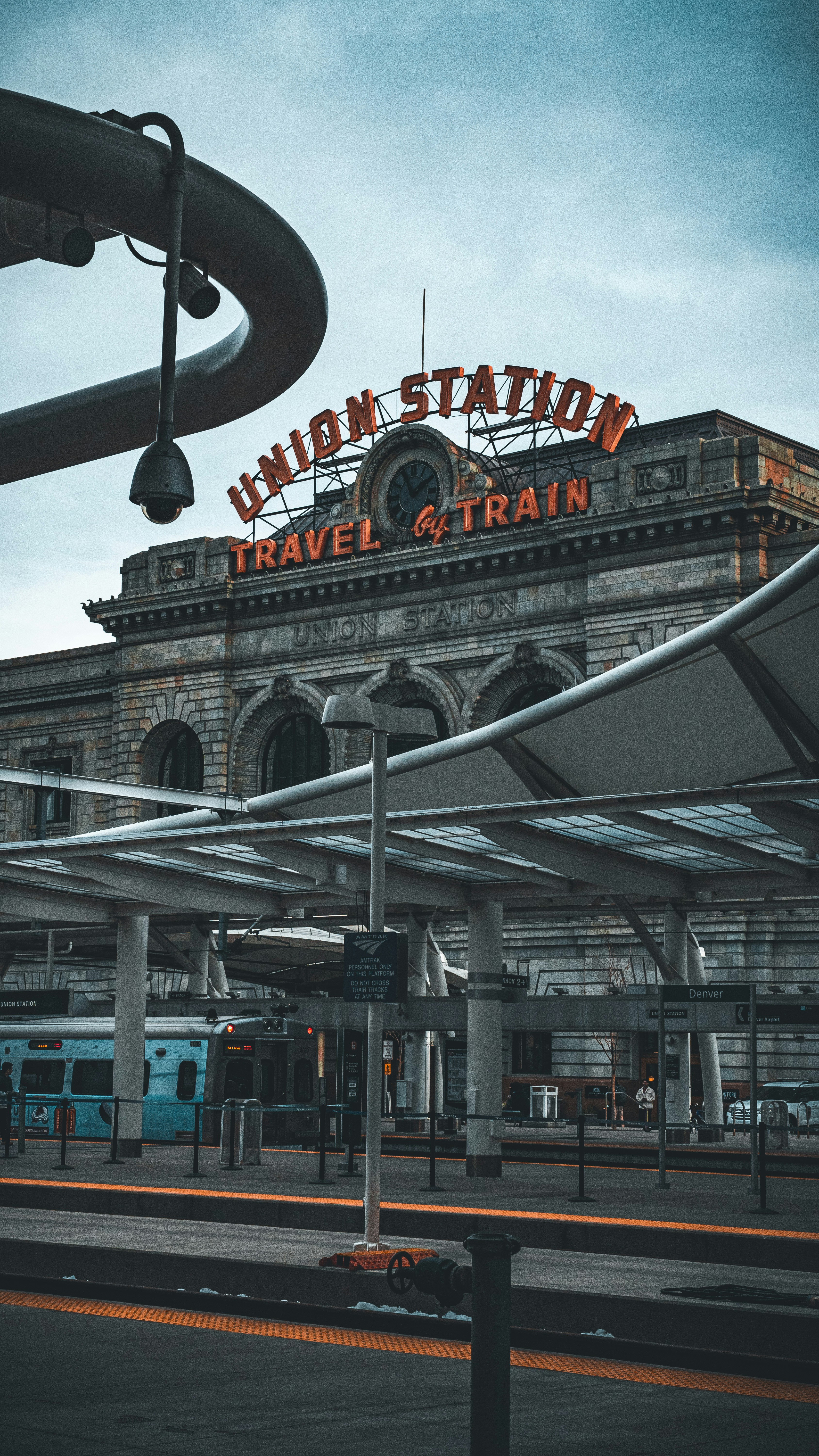 a train station with a train on the tracks