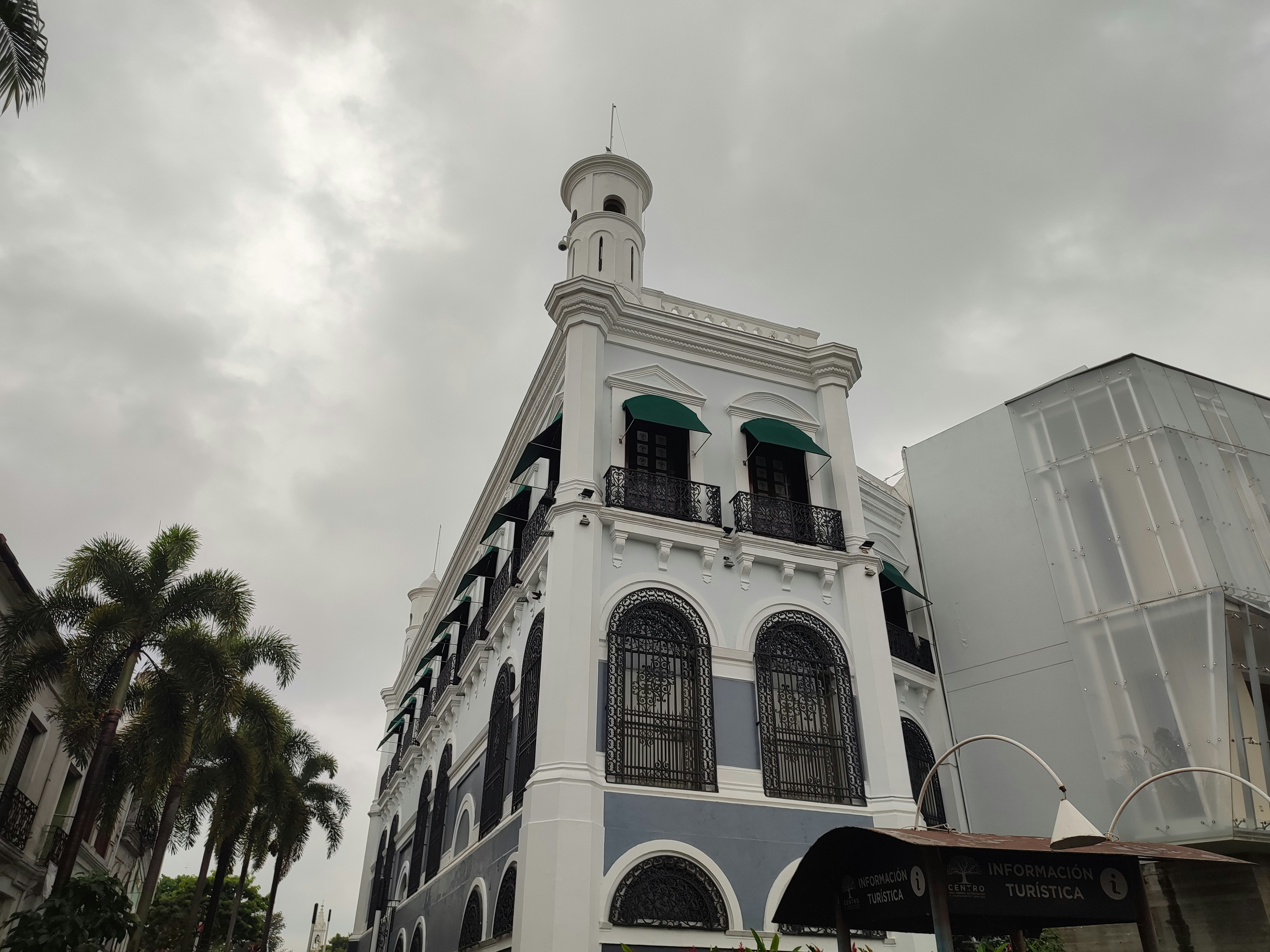 A white and blue building with a clock tower photo – Free México Image ...