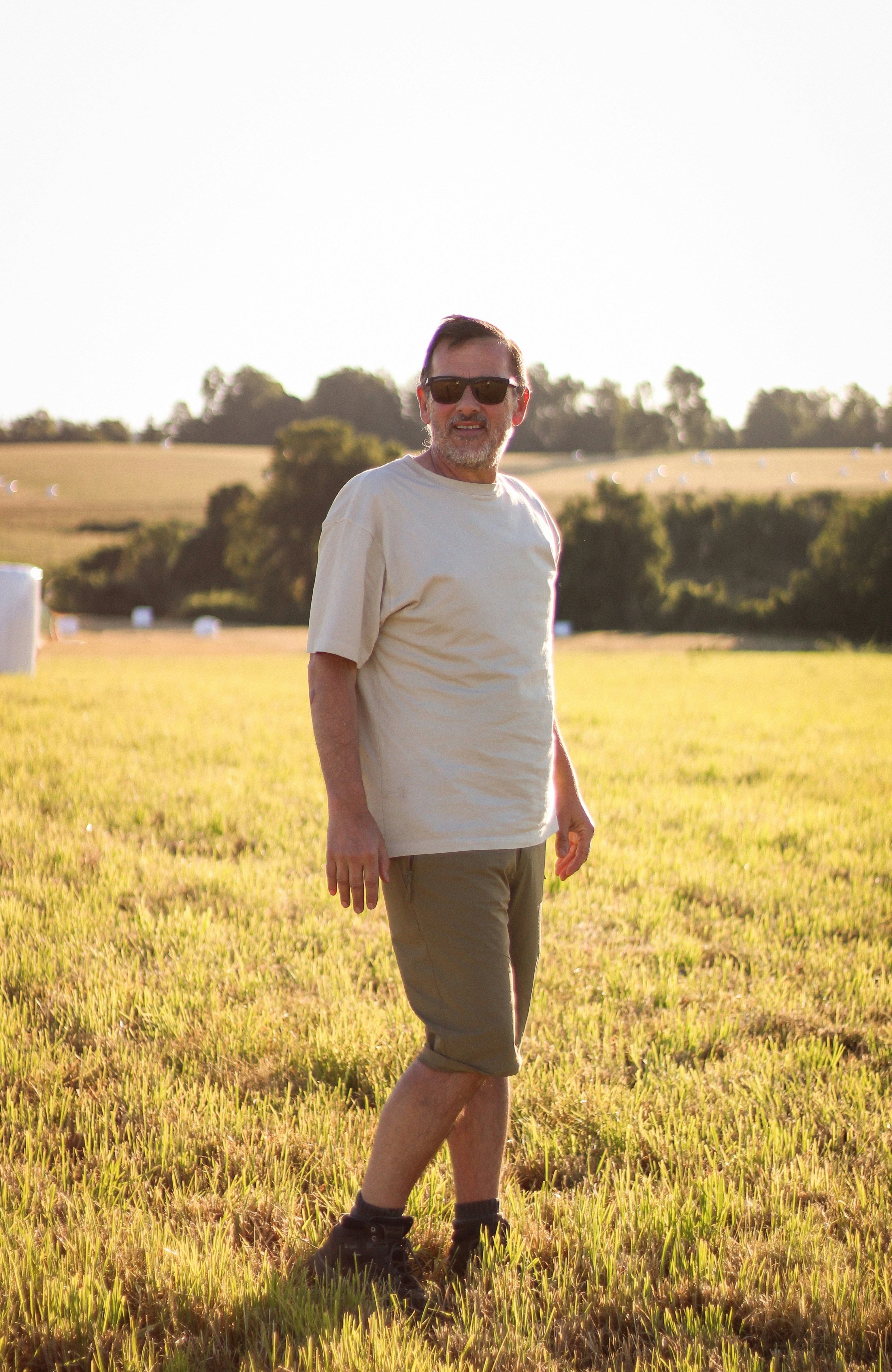 Golden Hour Portrait: A Quiet Stroll Through a Sunlit Field