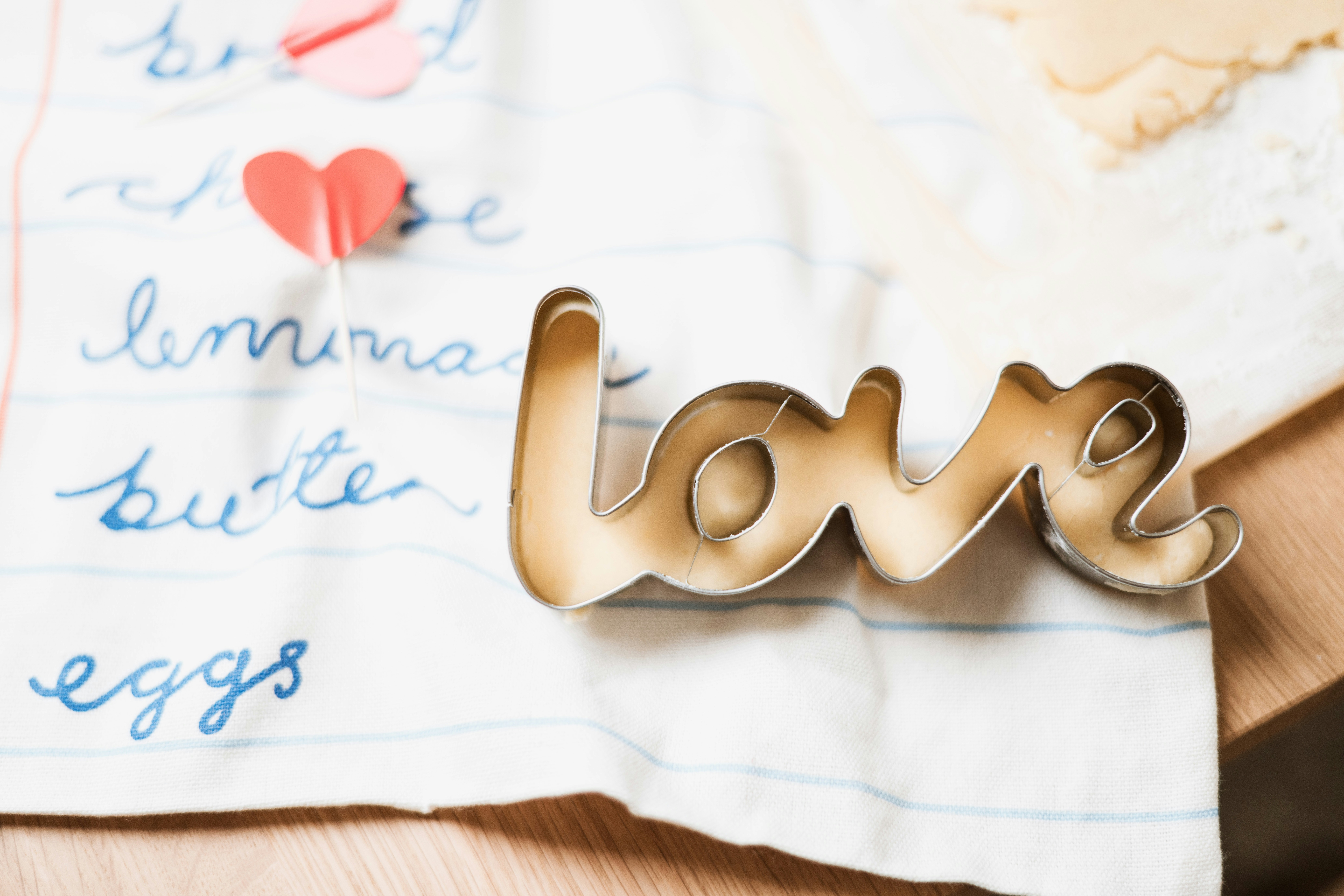 A cookie cutter shaped like the word love photo – Free Text Image on ...
