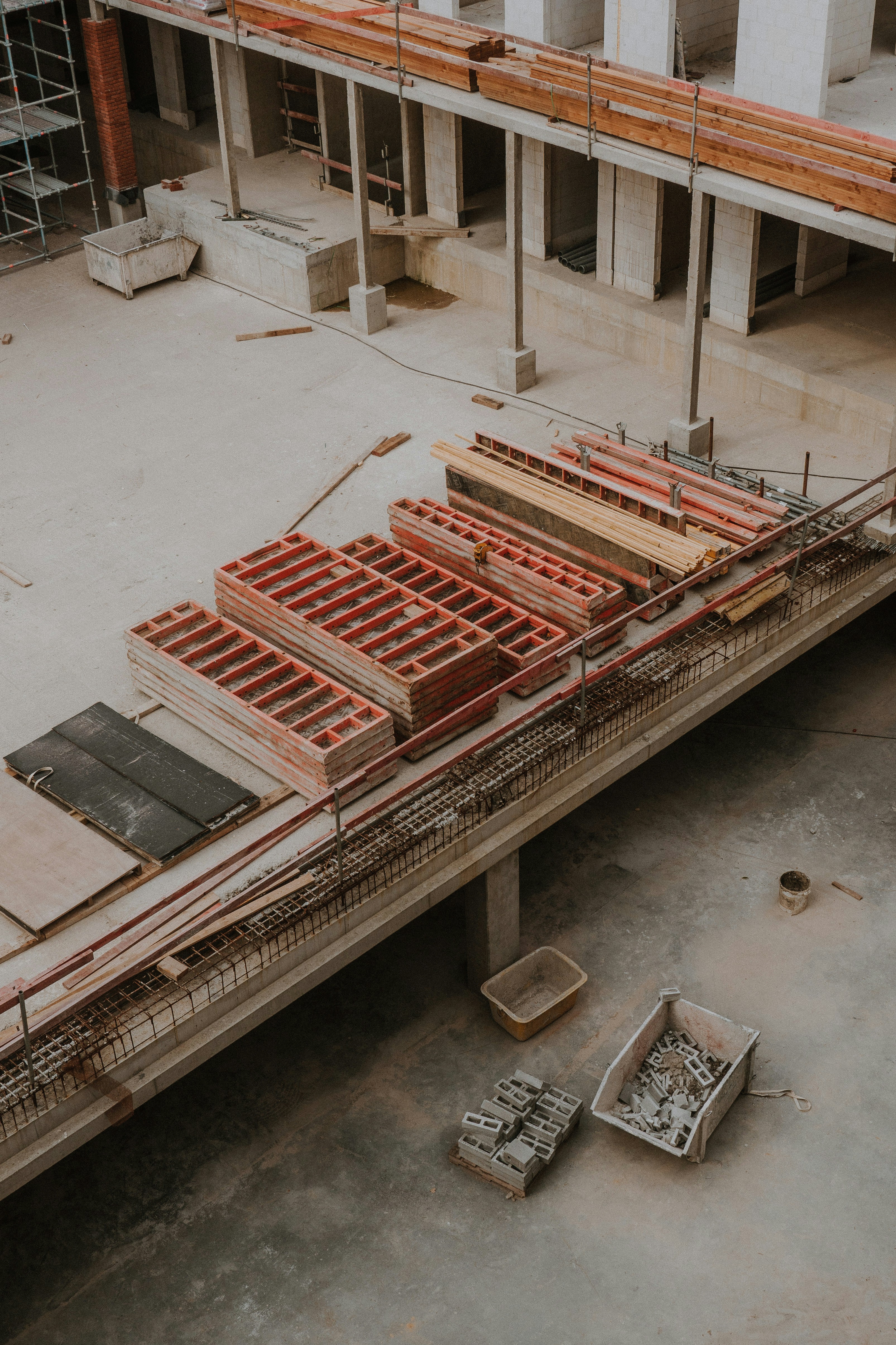 A large building under construction with a crane photo – Free ...