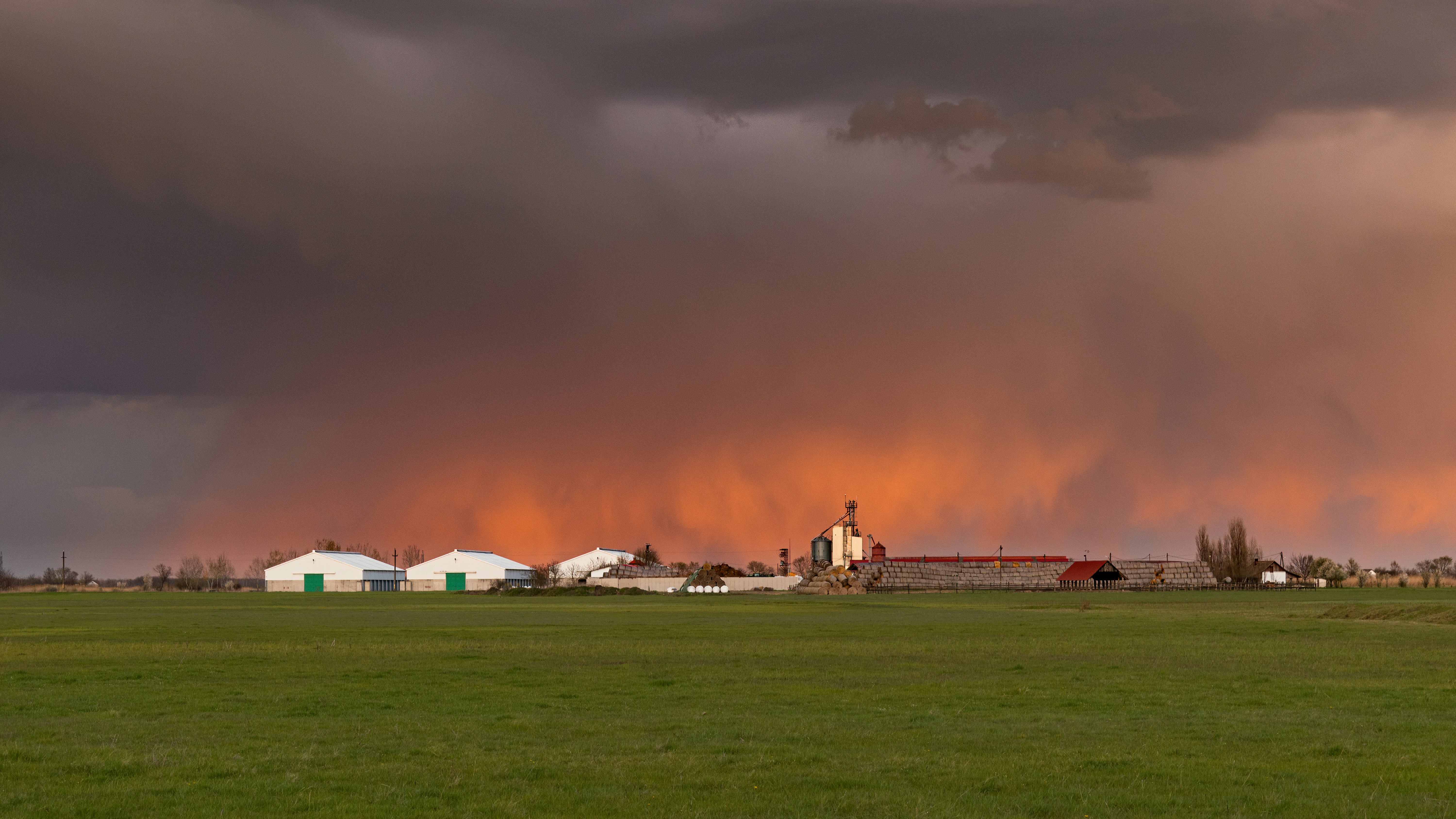 Ember Horizon Over a Quiet Prairie Farm at Dusk
