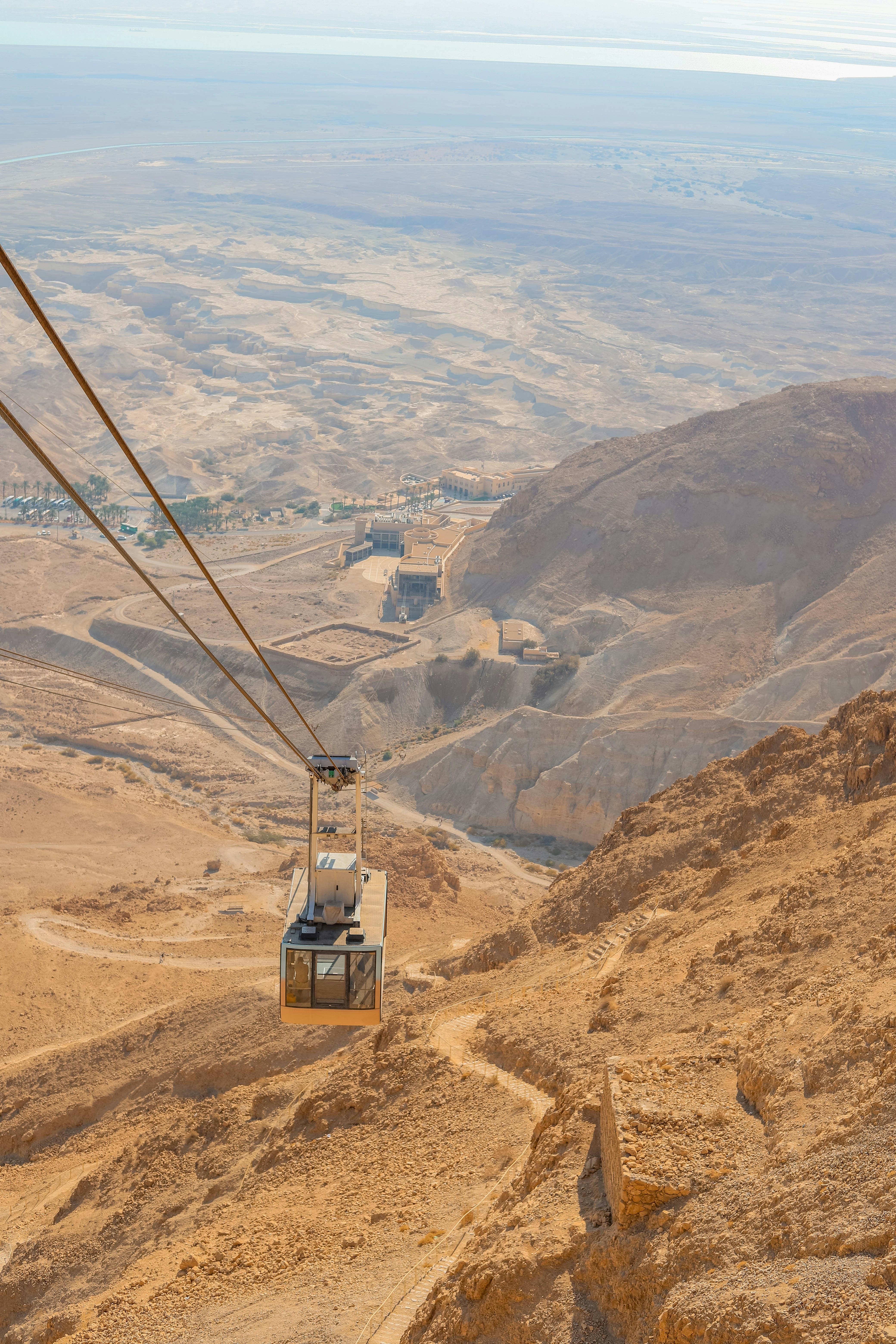 a cable car going up the side of a mountain