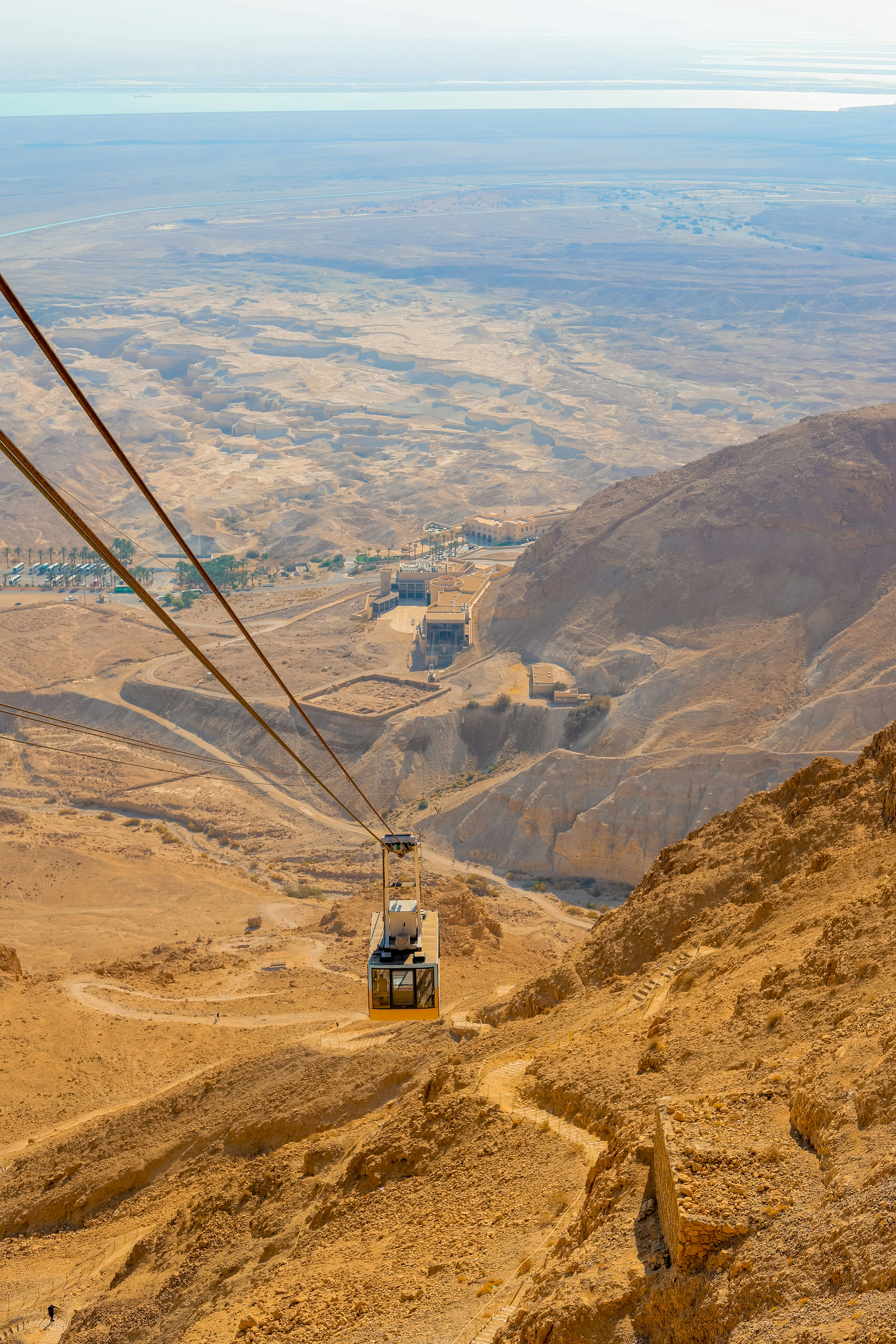 Cable Car Ascent over Desert Ridge toward the Valley