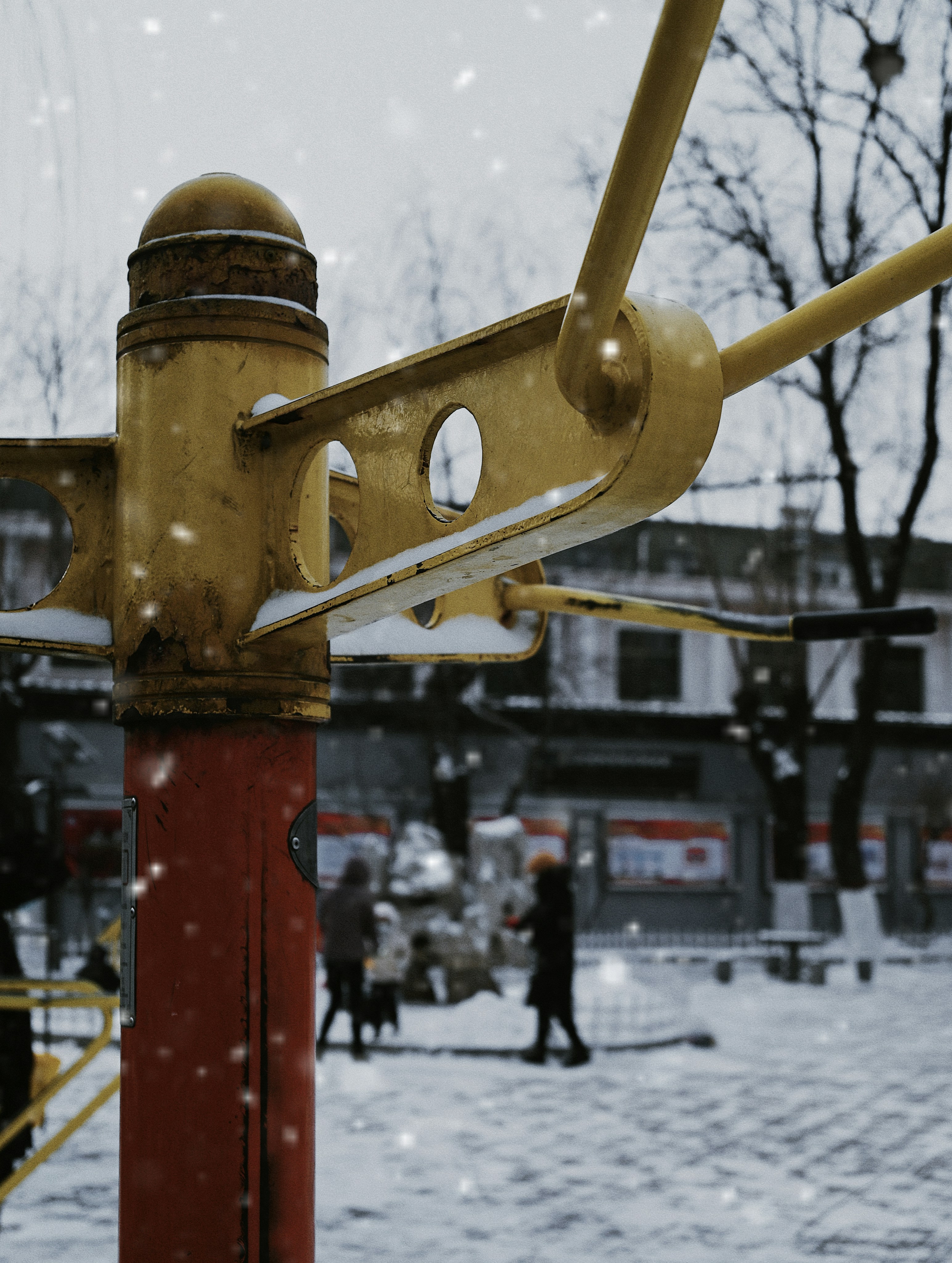 A yellow fire hydrant sitting on top of a red pole photo – Free Snow ...