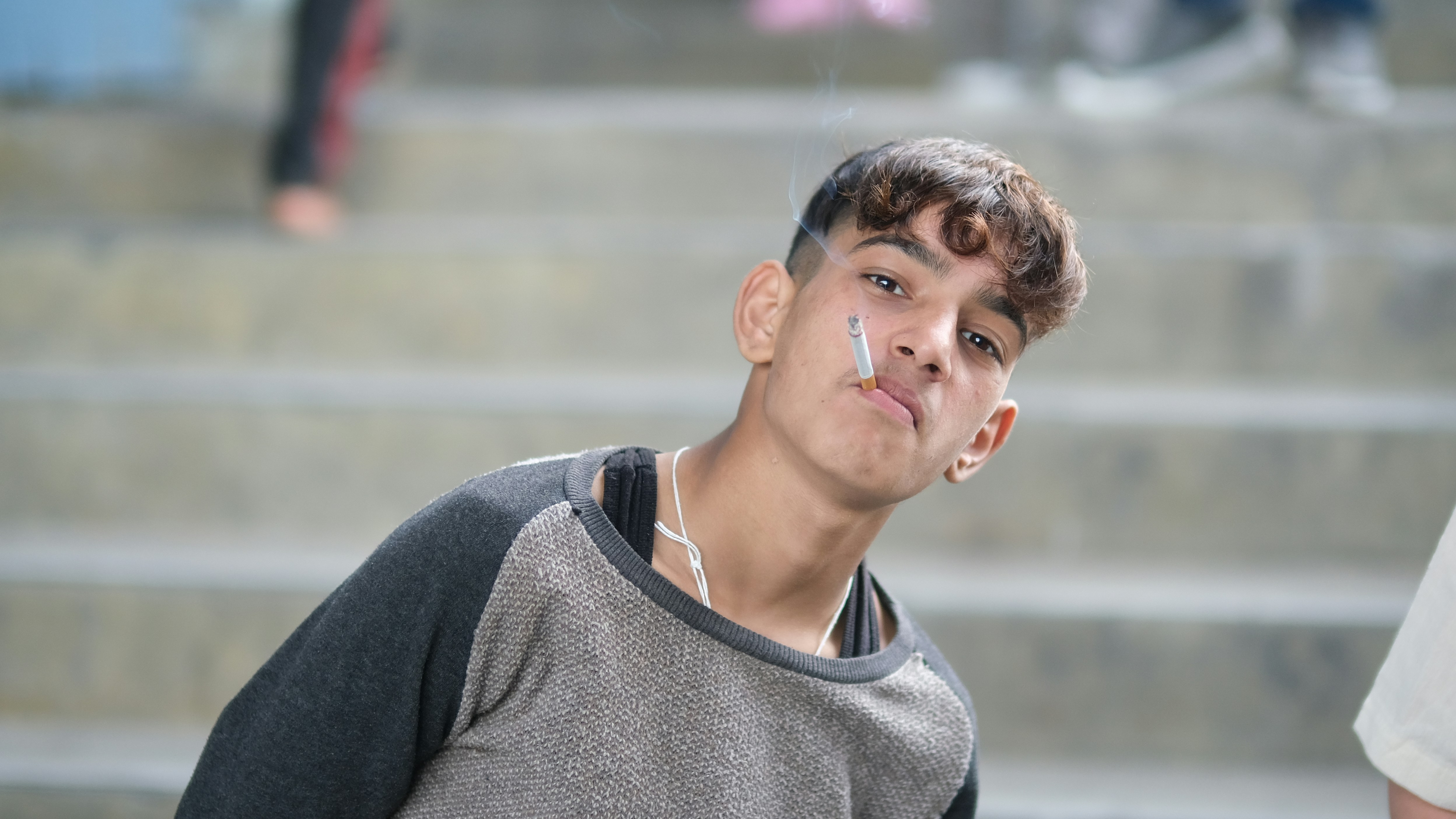 A young man with ear buds on his ears photo – Free Face Image on Unsplash