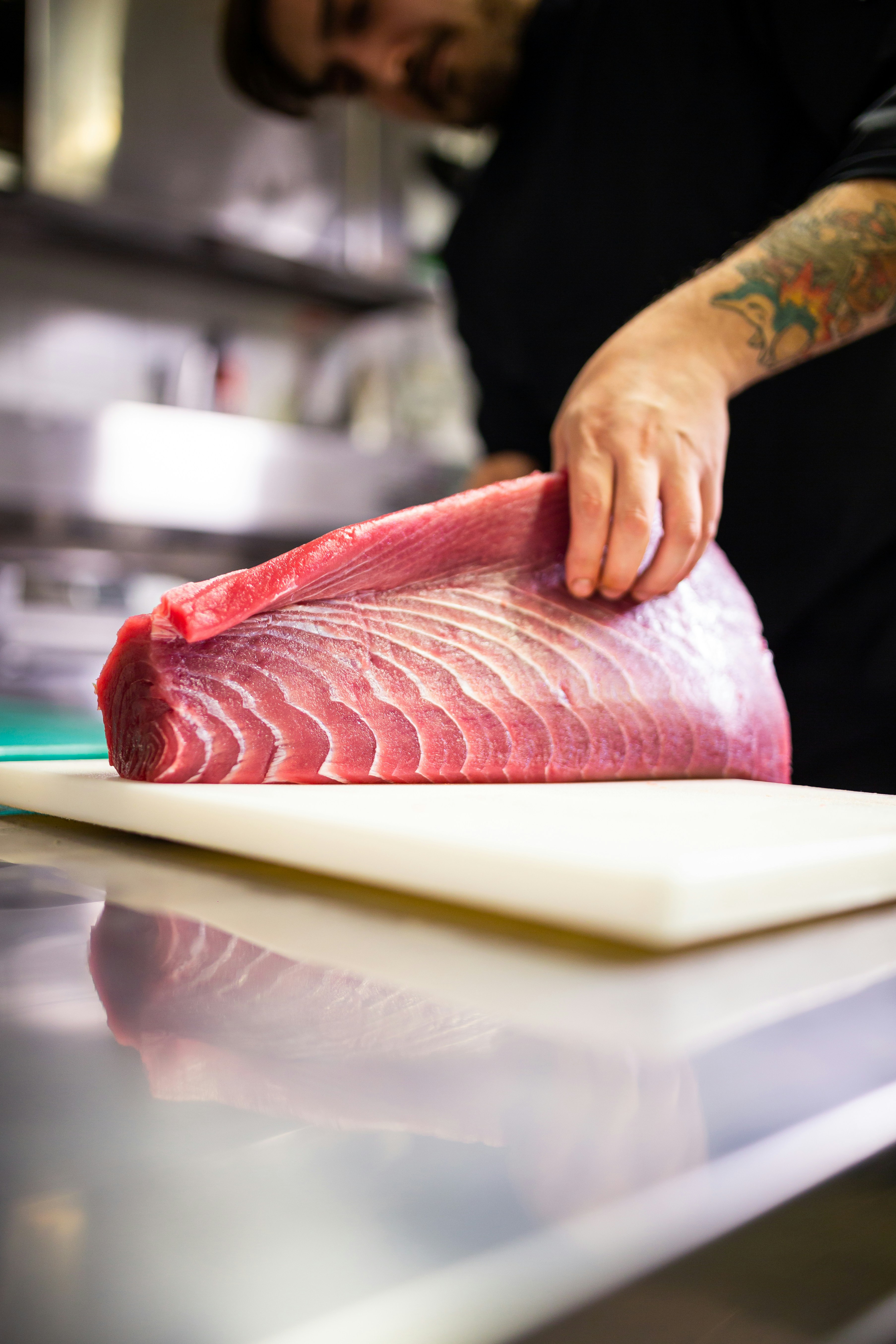 Butcher’s Red Finale: A Rolled Tuna Cut on Glass