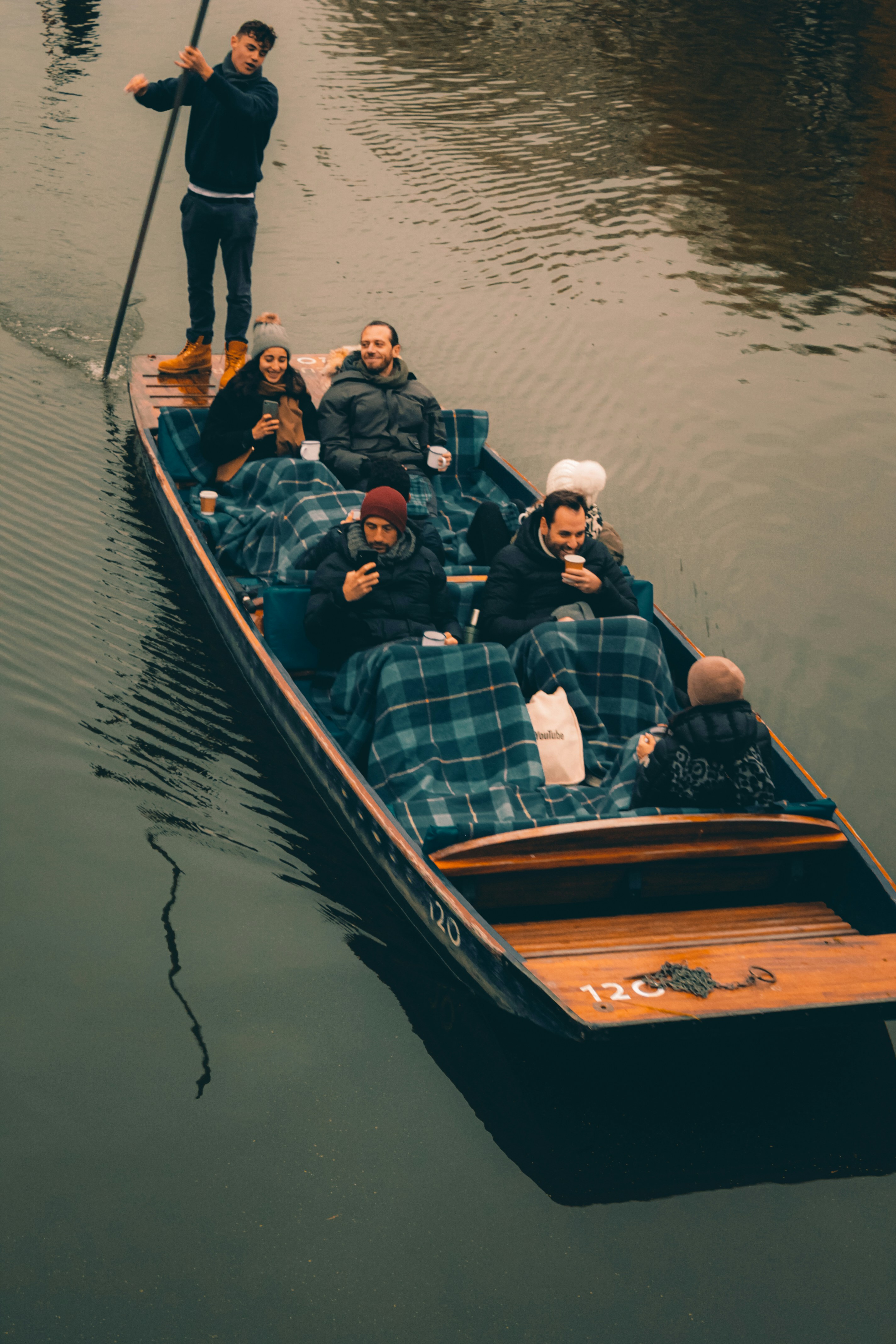 A group of people in a boat on a body of water photo – Free Cambridge ...