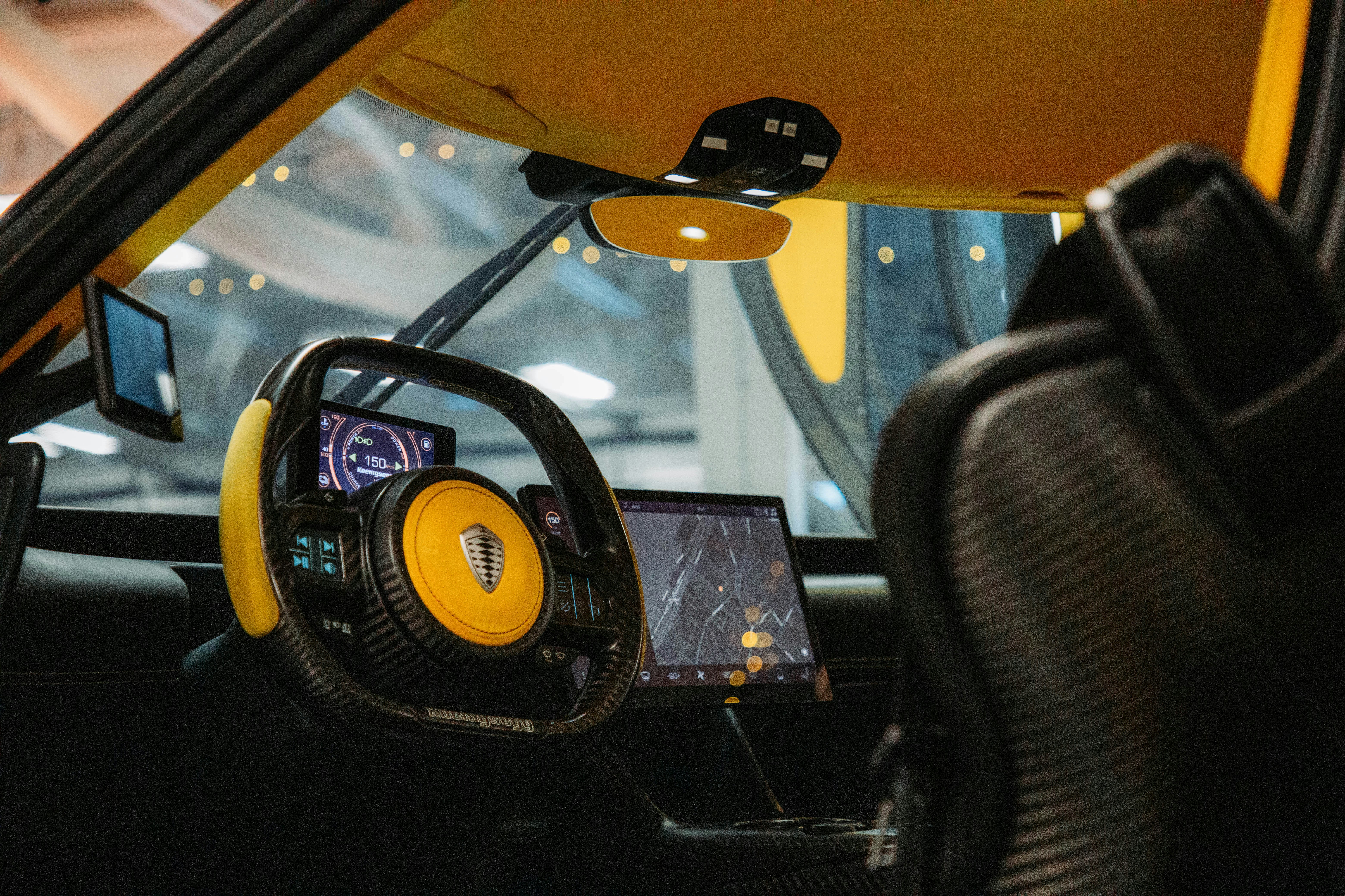 The interior of a car with a yellow dash board photo – Free Denver ...