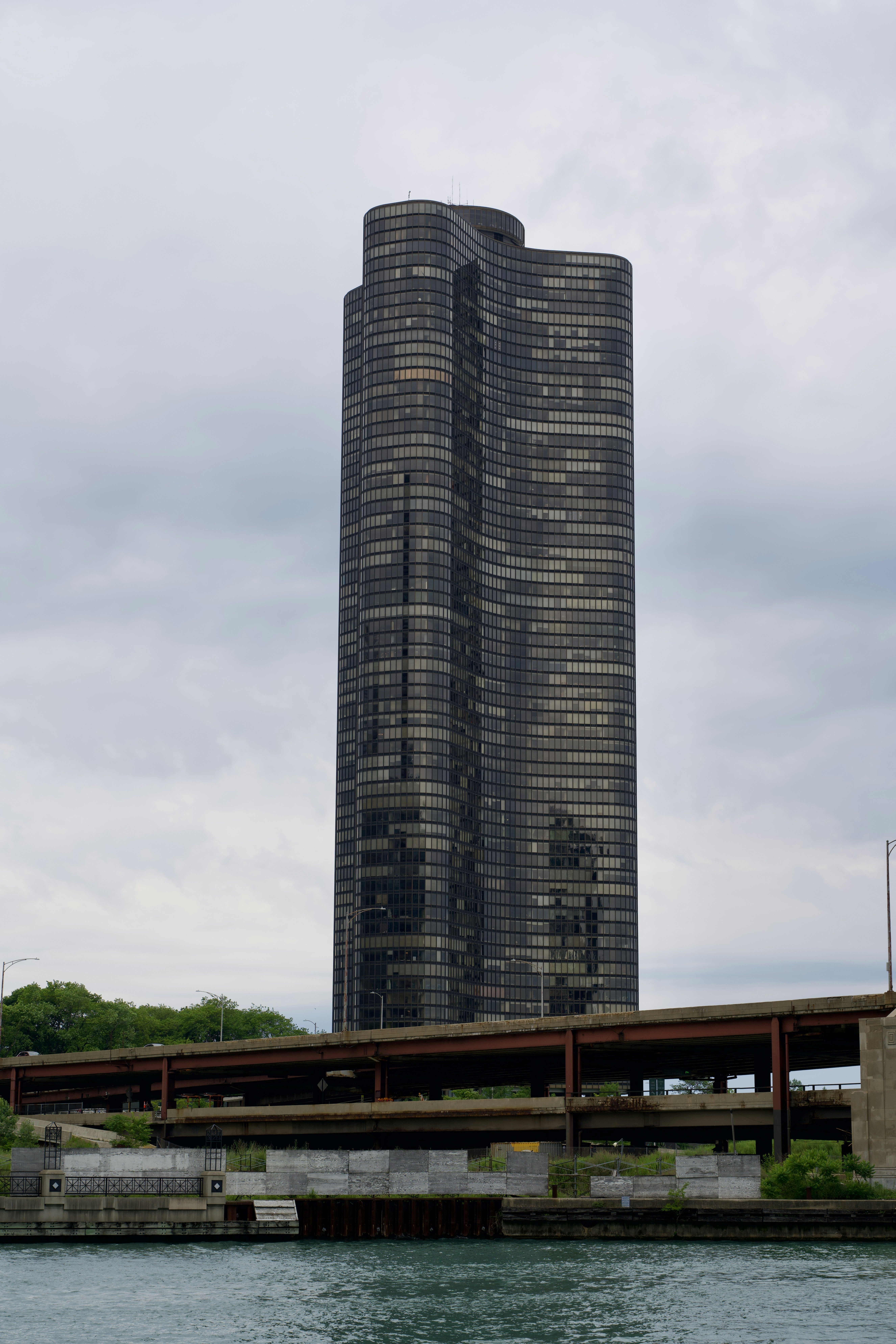 Twin-Curved Tower Rising Above the Waterfront Highway