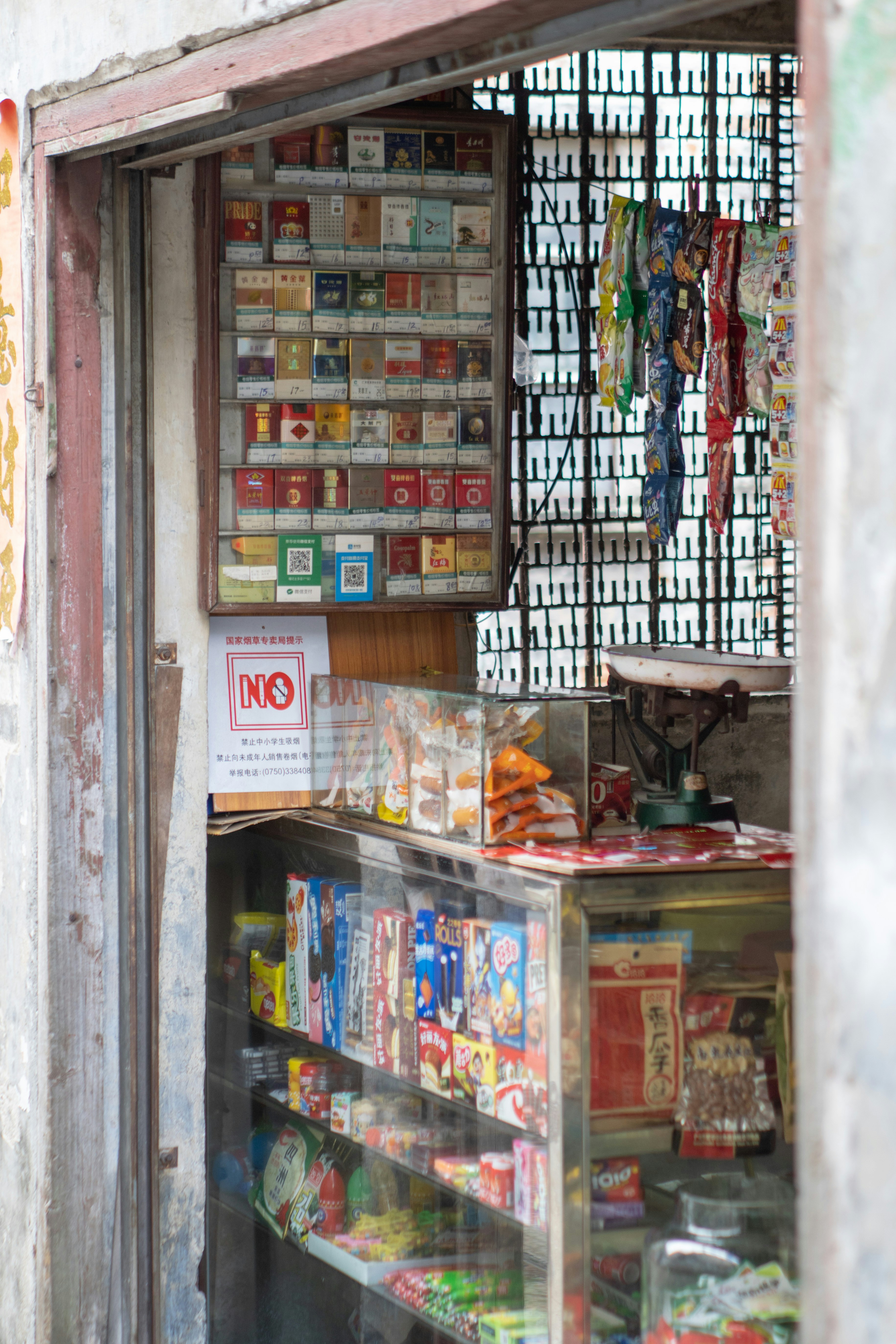 a store front with a lot of food on display